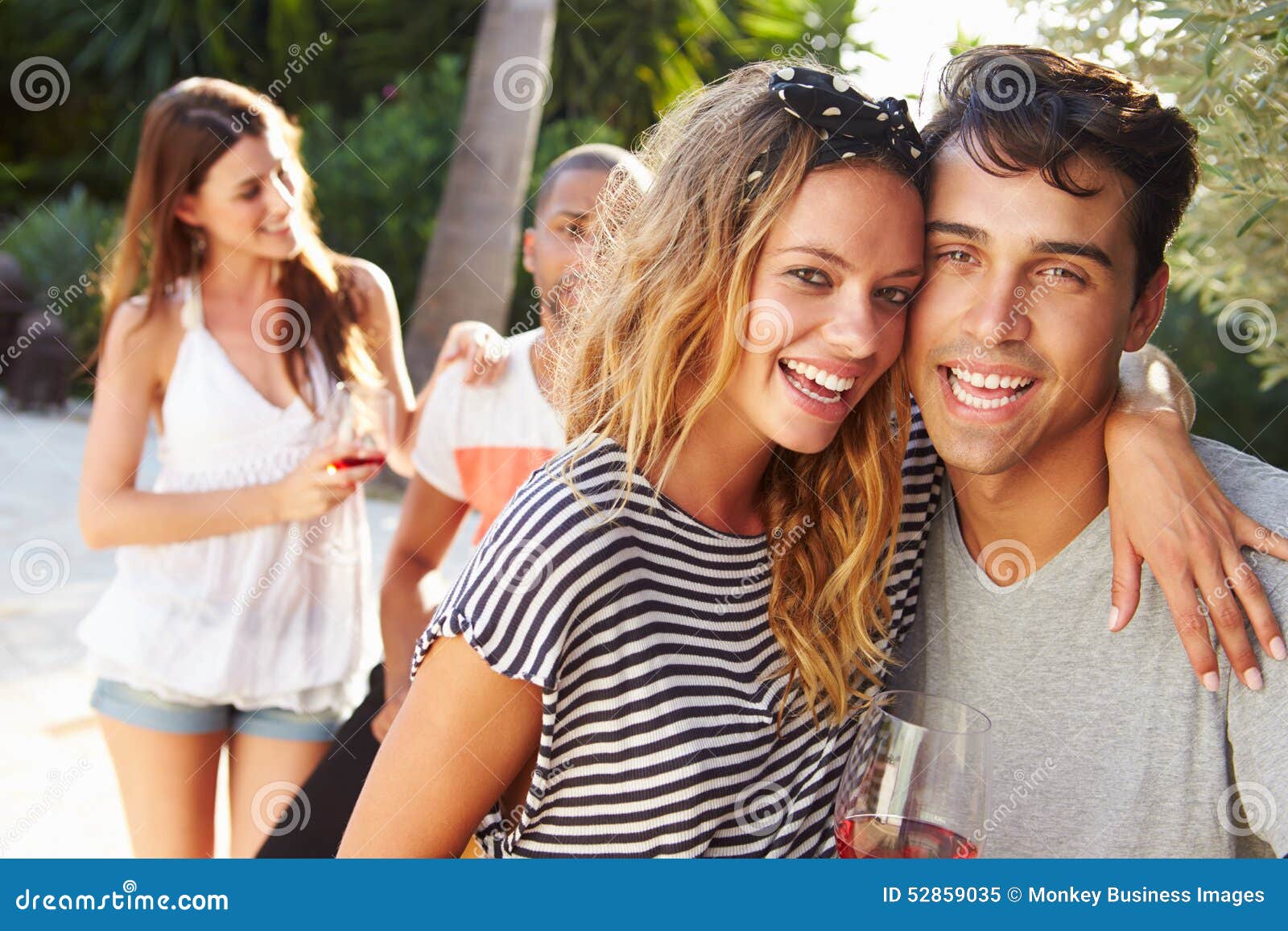 Couple with Friends Drinking Wine and Relaxing Outdoors Stock Image ...