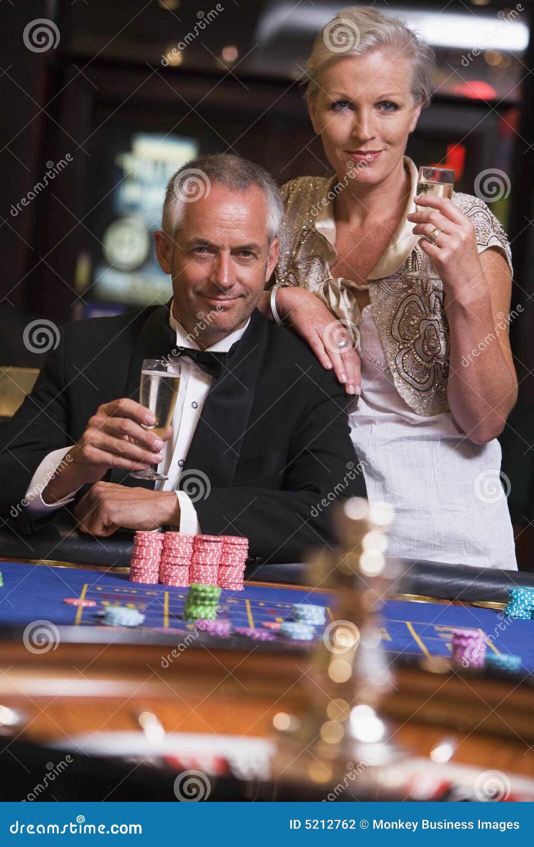 Couple Gambling at Roulette Table Stock Photo - Image of male, glass ...