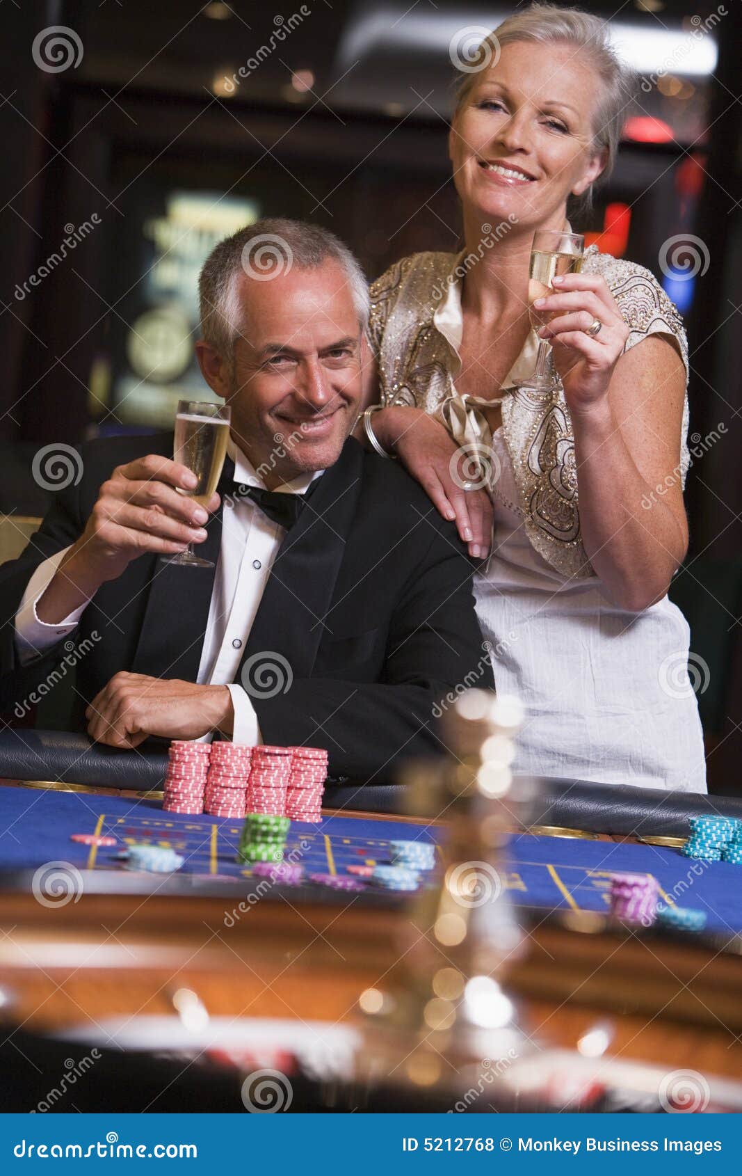 Couple Gambling at Roulette Table Stock Photo - Image of evening ...