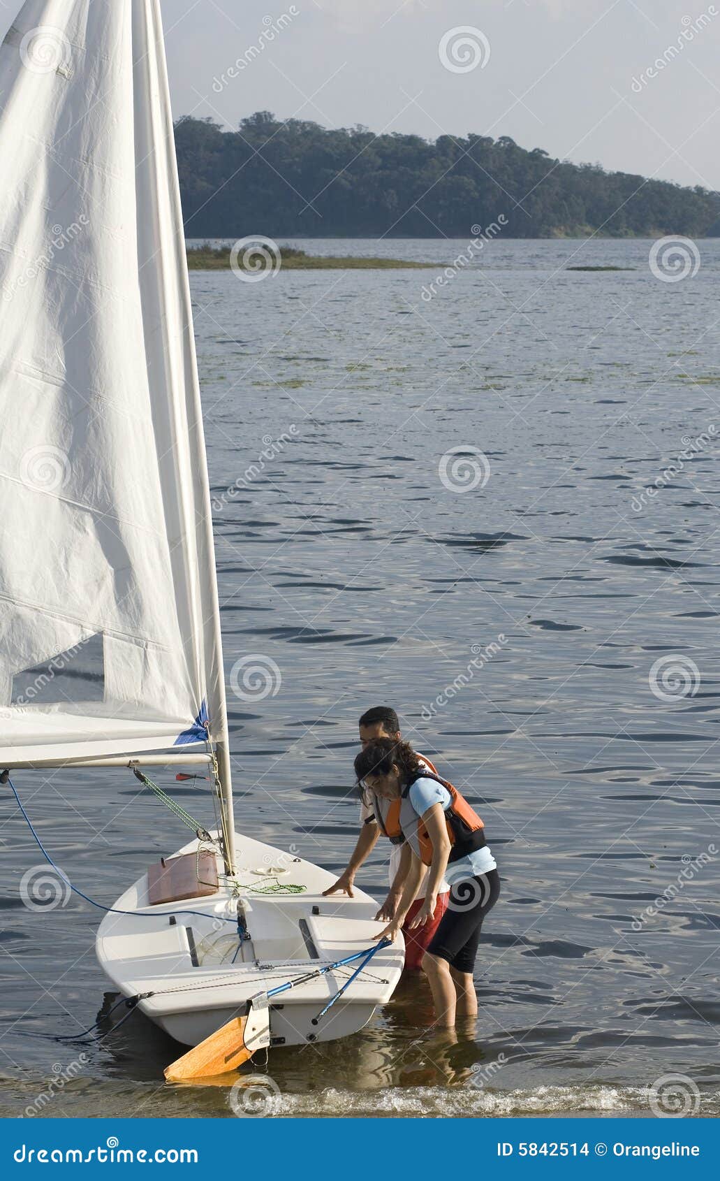 Couple Getting Ready To Go Sailing - Vertical Stock Photo - Image of ...