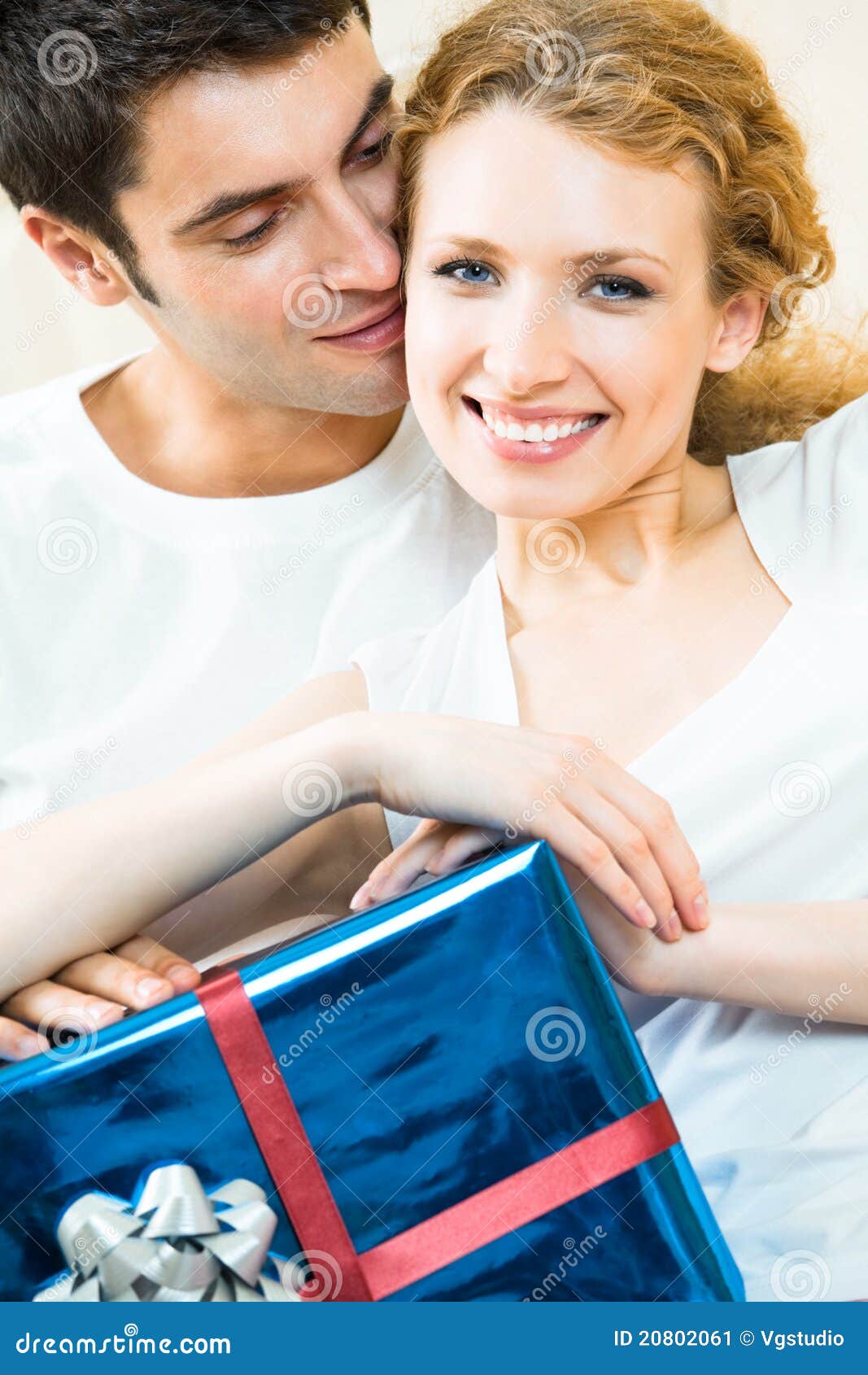 Couple with gift stock image. Image of congratultions - 20802061