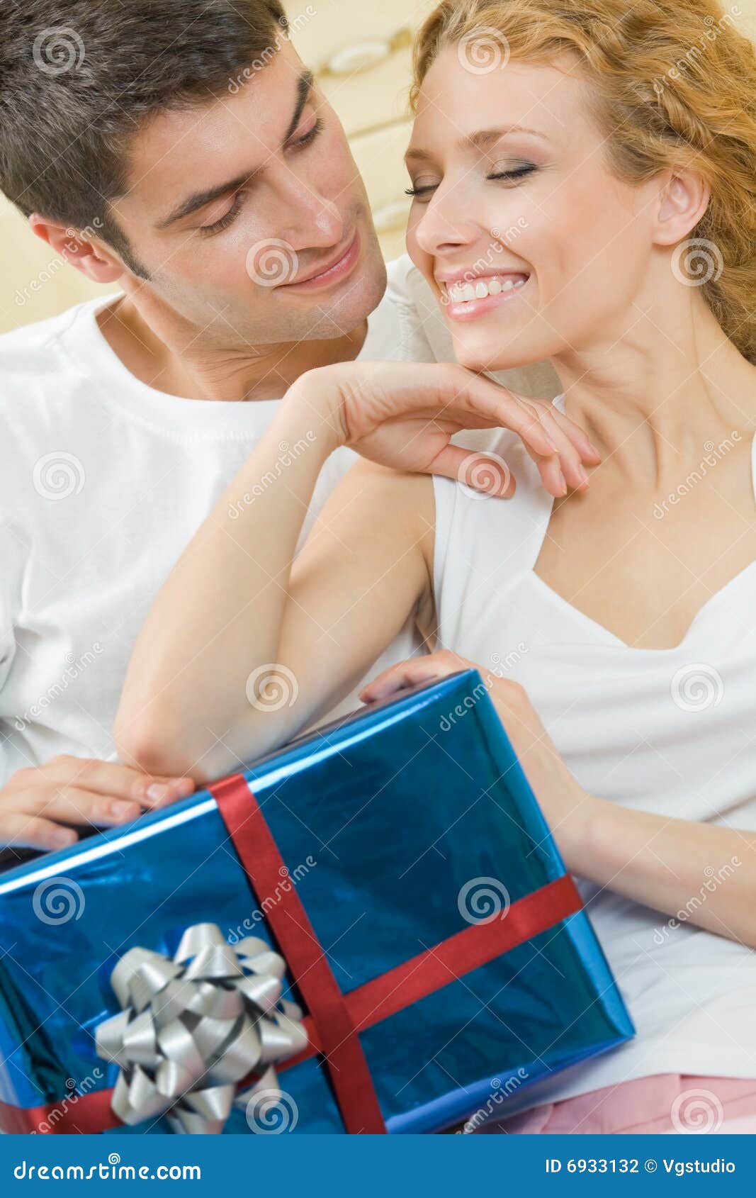 Couple with gift at home stock photo. Image of gift, adult - 6933132