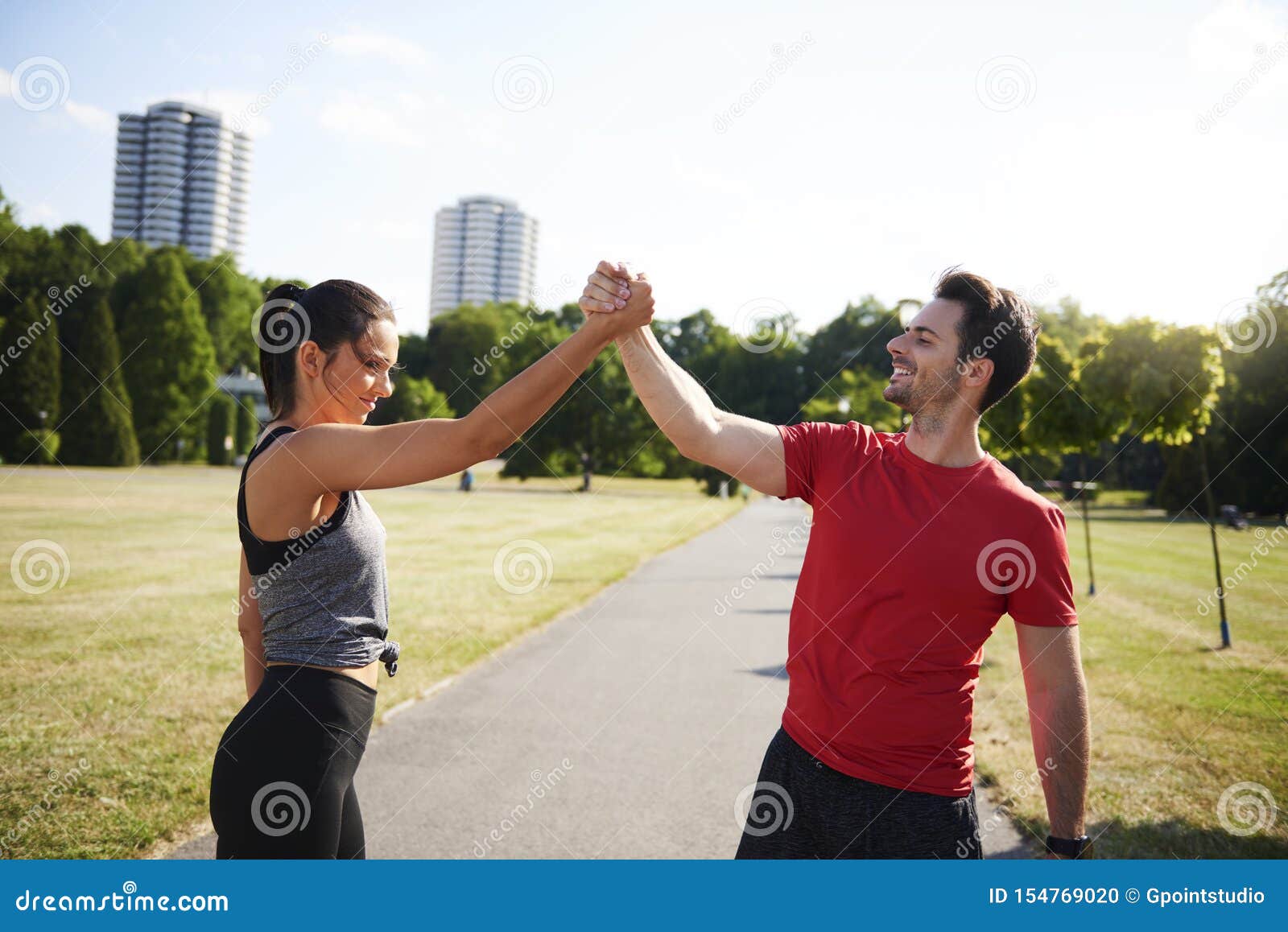 Couple Giving Each Other a High Five Stock Photo - Image of lane, hand ...