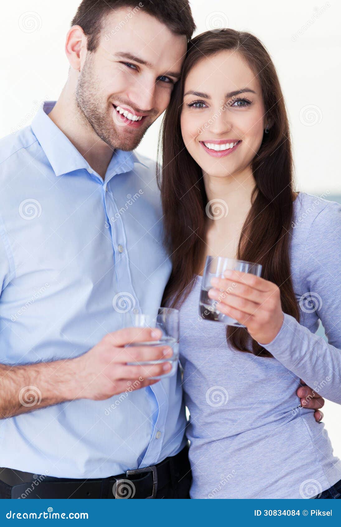 Couple with Glasses of Water Stock Photo - Image of glass, joyful: 30834084