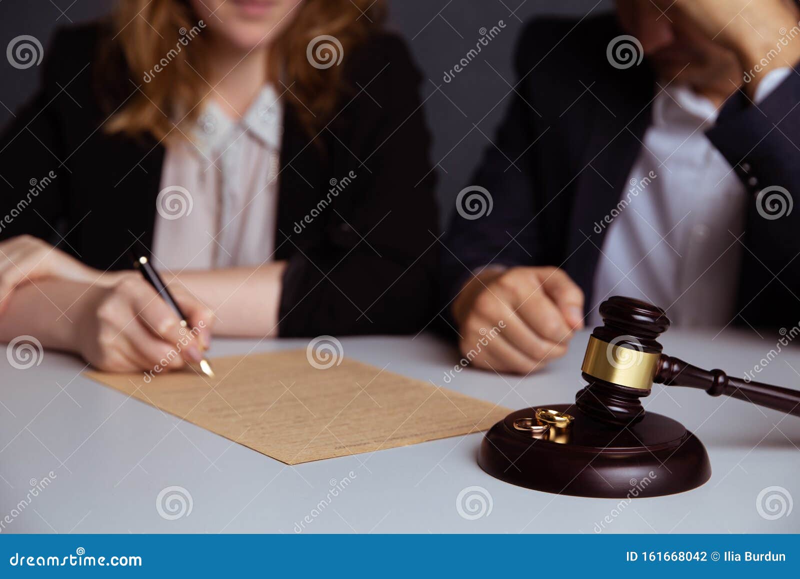 Couple Going through Divorce Signing Papers. Stock Photo - Image of ...