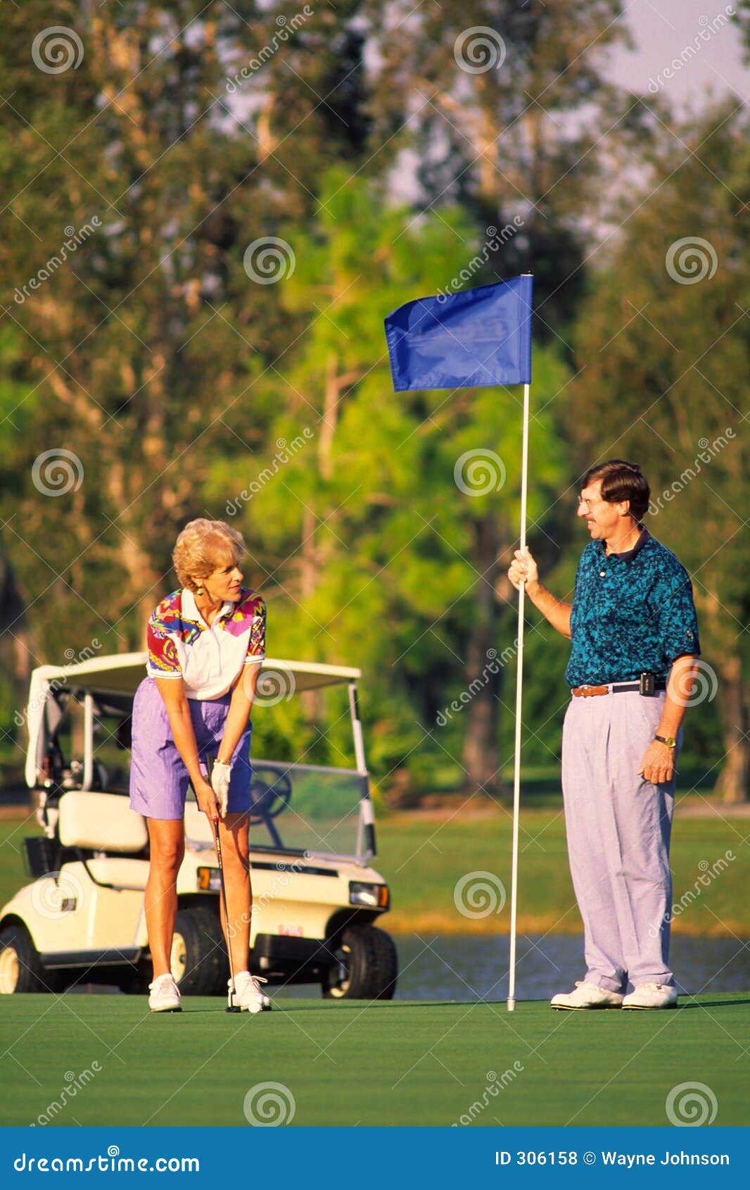 Couple Golfing 2 stock photo. Image of athletes, sports - 306158