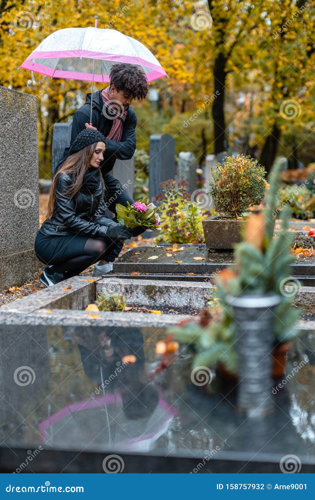 Couple in Grief on a Cemetery in Fall Stock Photo - Image of burial ...