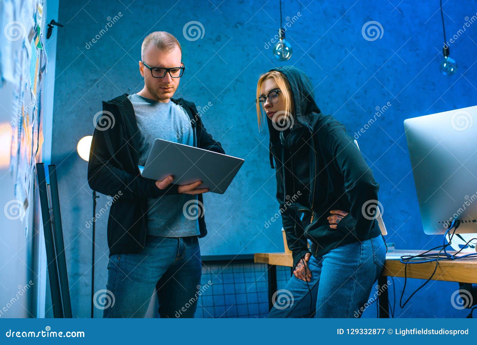 Couple of Hackers with Laptop Stock Image - Image of computers, hoodies ...