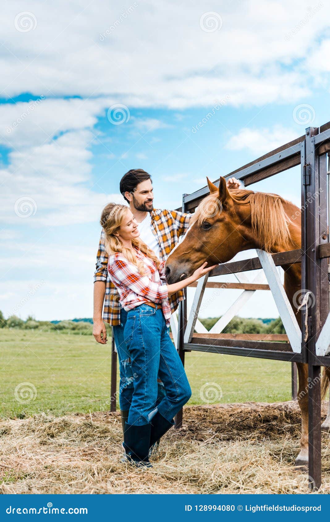 Couple of Happy Ranchers Palming Horse Stock Photo - Image of adults ...