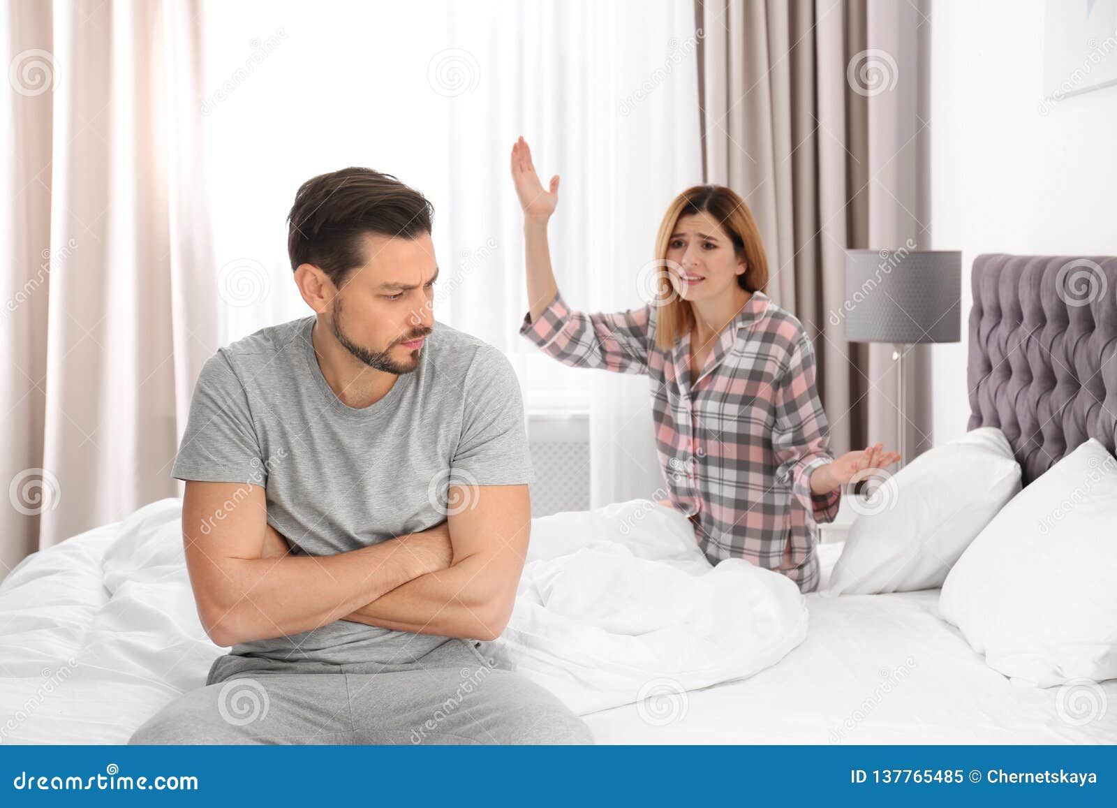 Couple Having Argument in Bedroom Stock Image - Image of couple, people ...