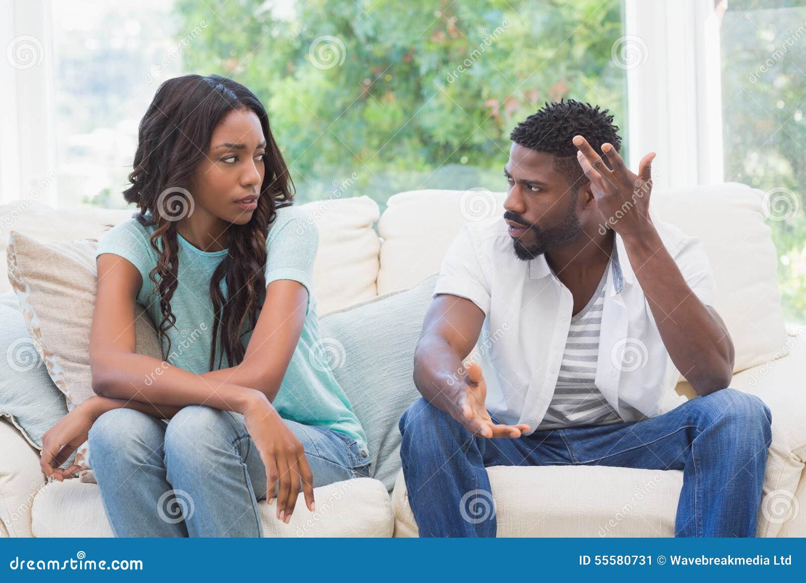 Couple Having Argument on the Couch Stock Image - Image of frowning ...