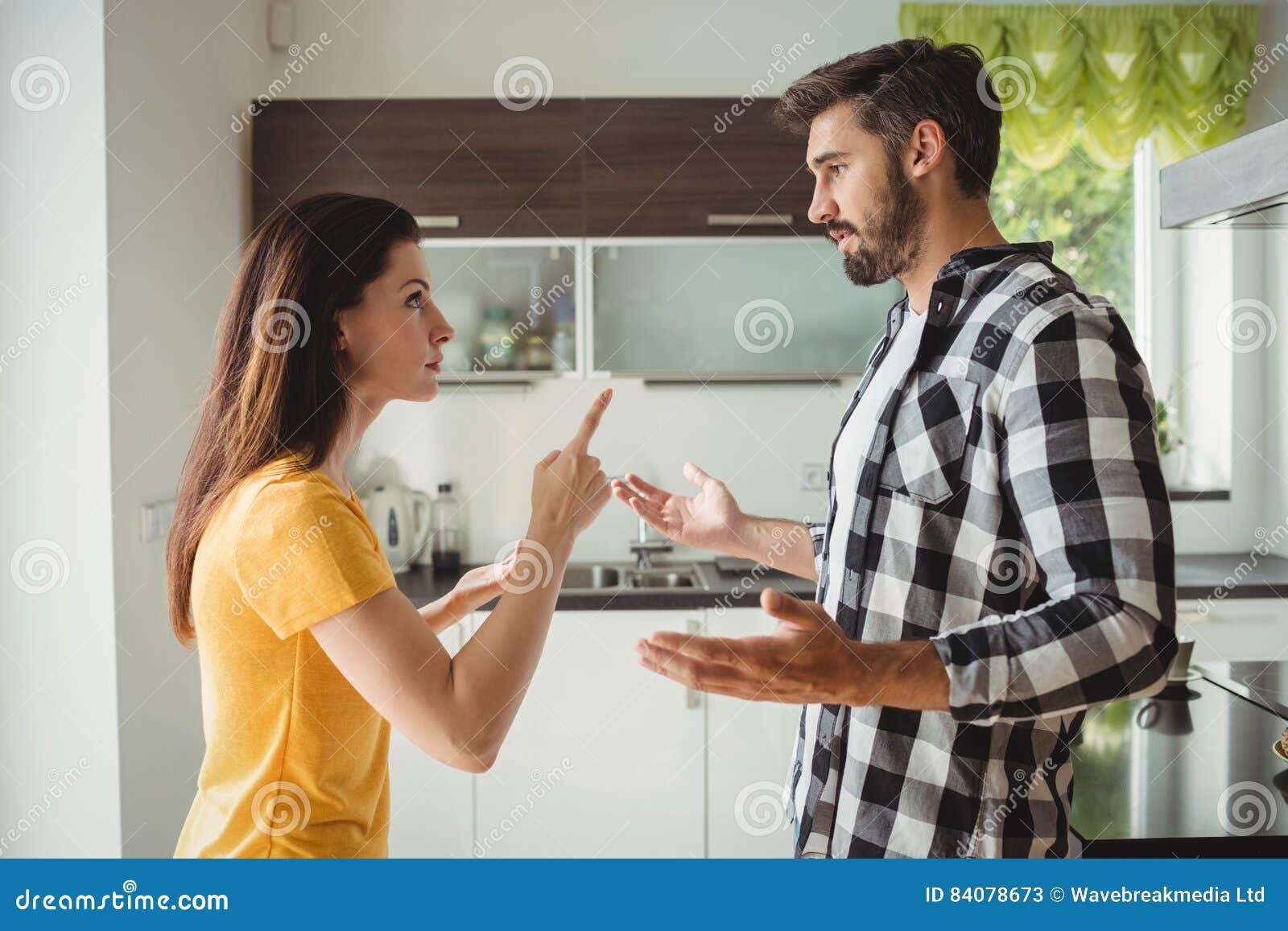 Couple Having Argument in Kitchen Stock Image - Image of attractive ...