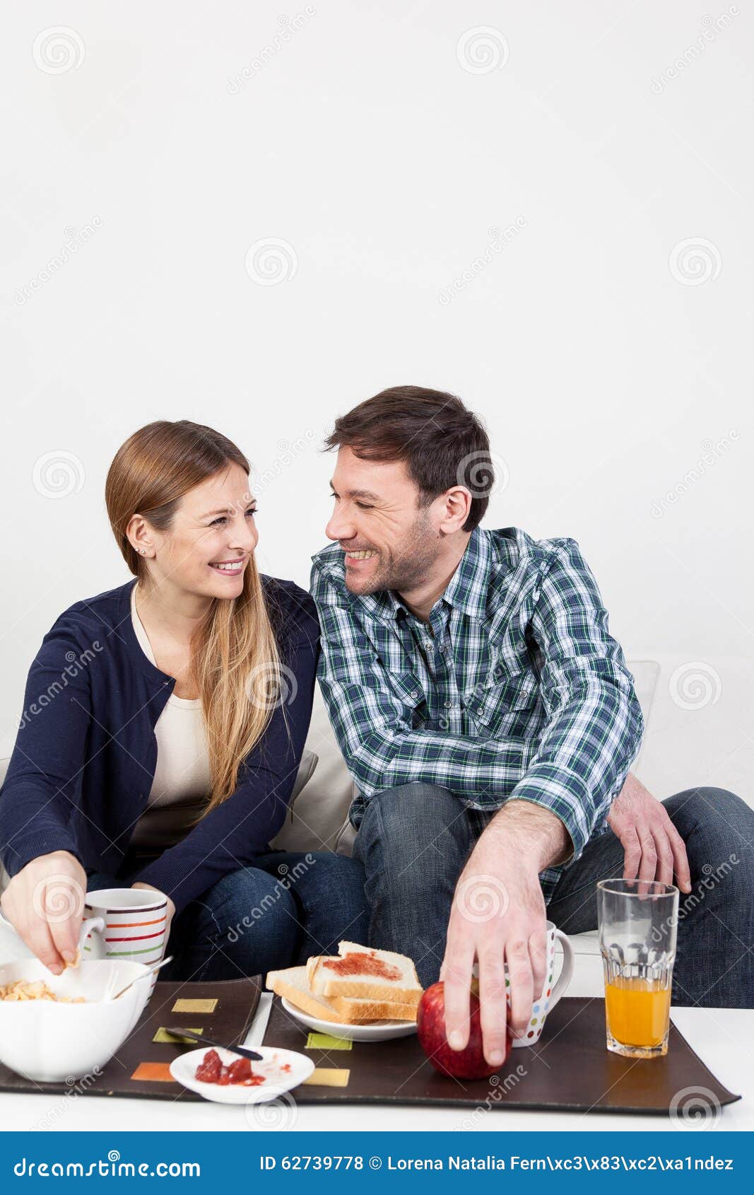 Couple having a breakfast stock photo. Image of cereal - 62739778