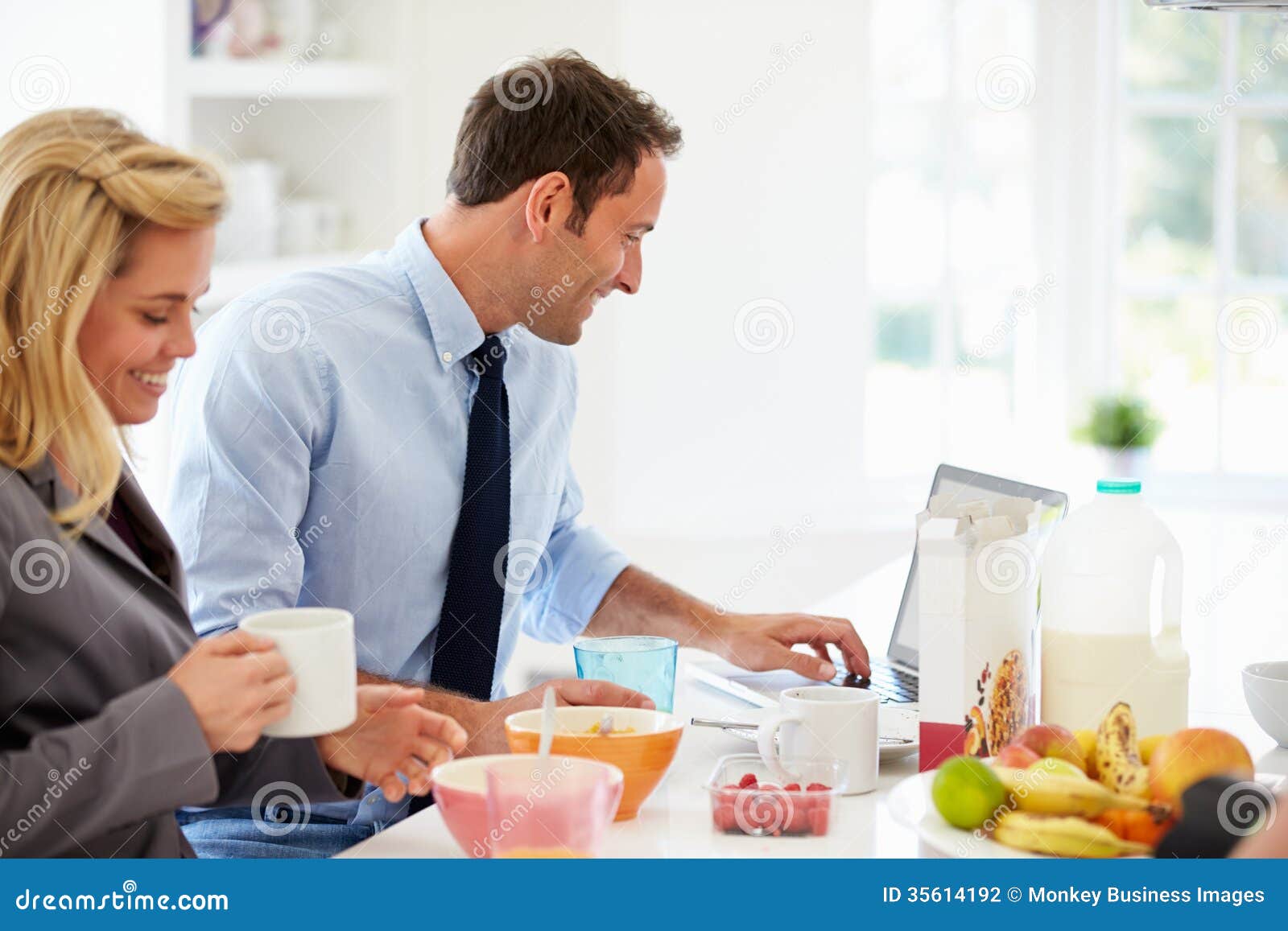 Couple Having Breakfast Together before Leaving for Work Stock Photo ...