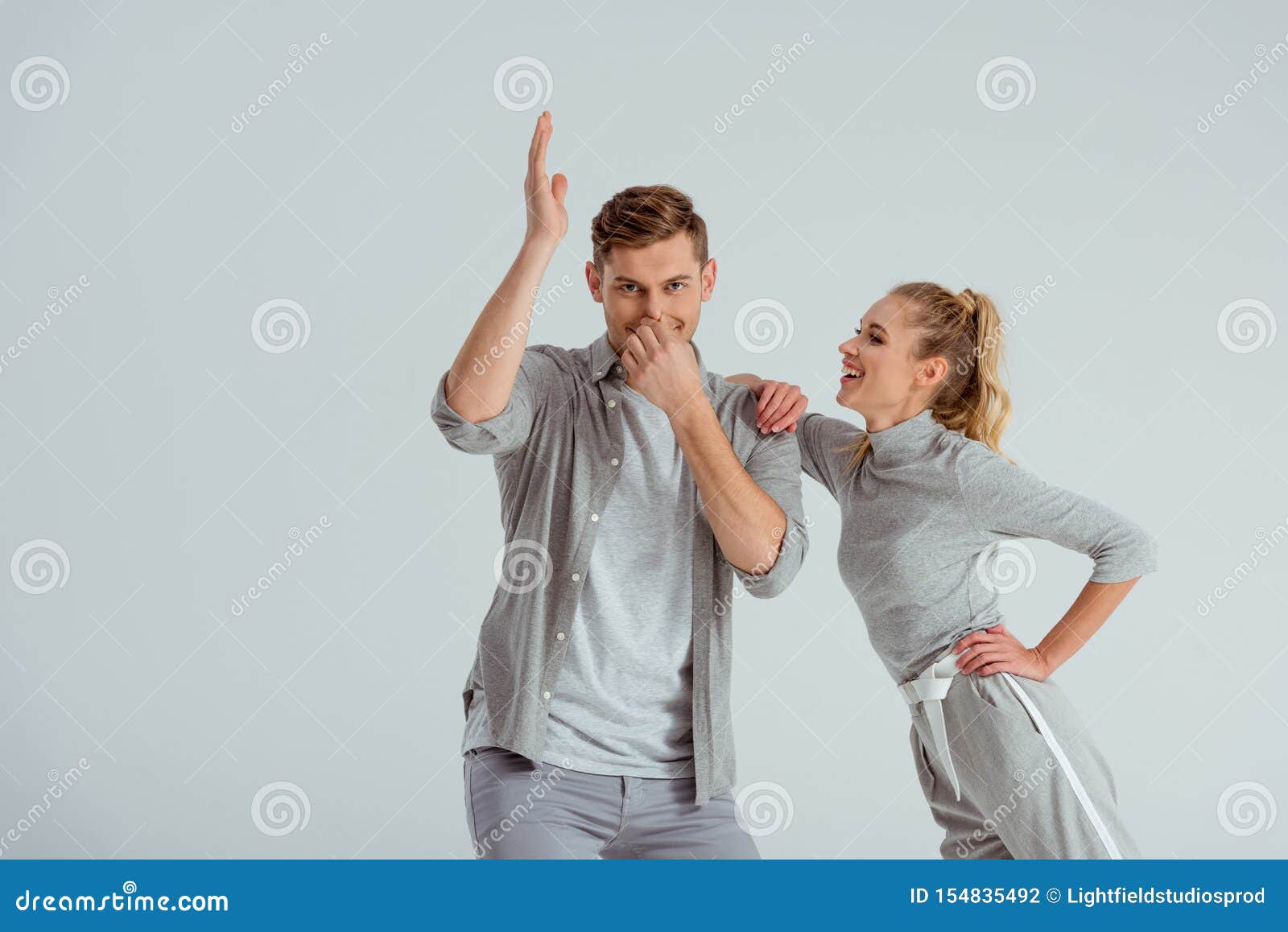 Couple Having Fun and Man Doing Swim Dance Move Isolated Stock Photo ...