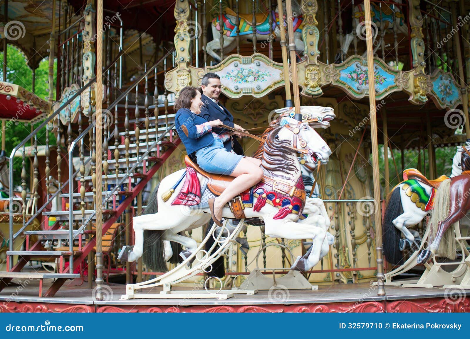 Couple Having Fun on Merry-go-round Stock Photo - Image of merrygoround ...