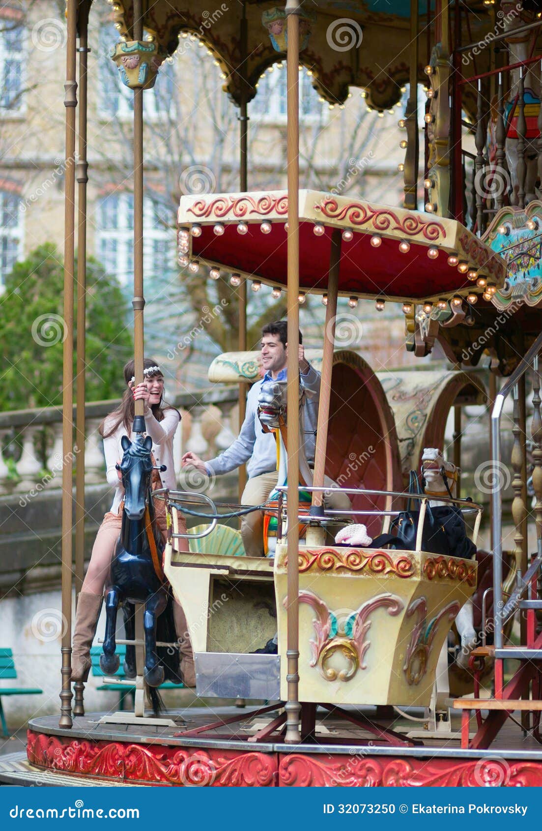 Couple Having Fun on Merry-go-round Stock Photo - Image of dating, date ...
