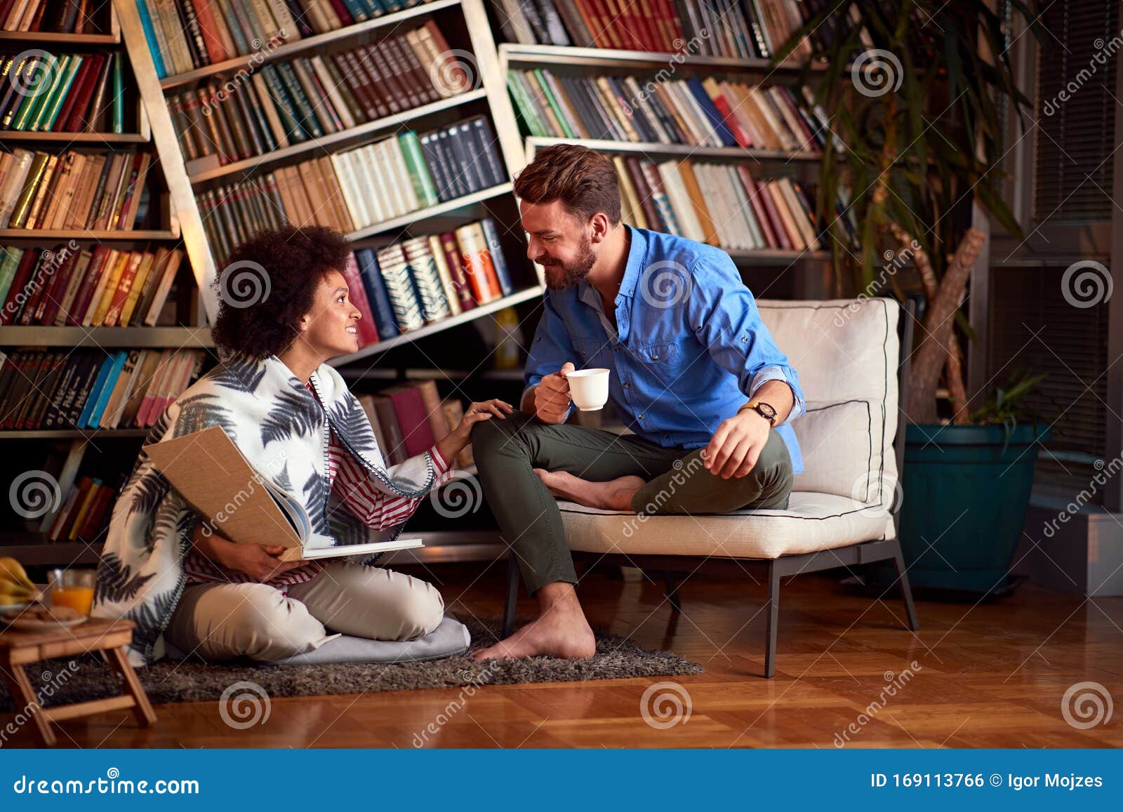 Couple Having Fun in Room with Book and Coffee Stock Photo - Image of ...