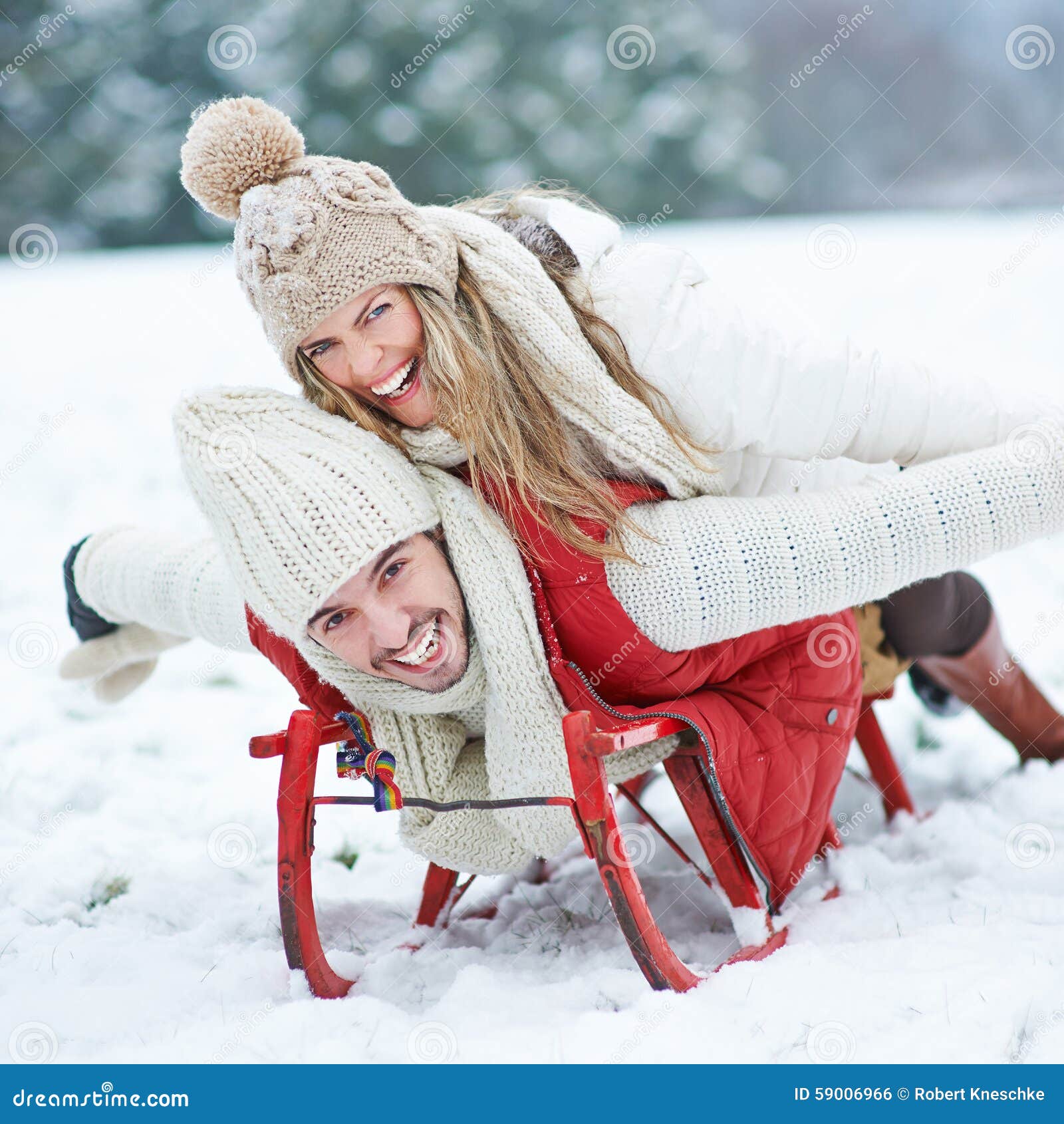 Couple Having Fun on Sled in Winter Stock Photo - Image of couple ...