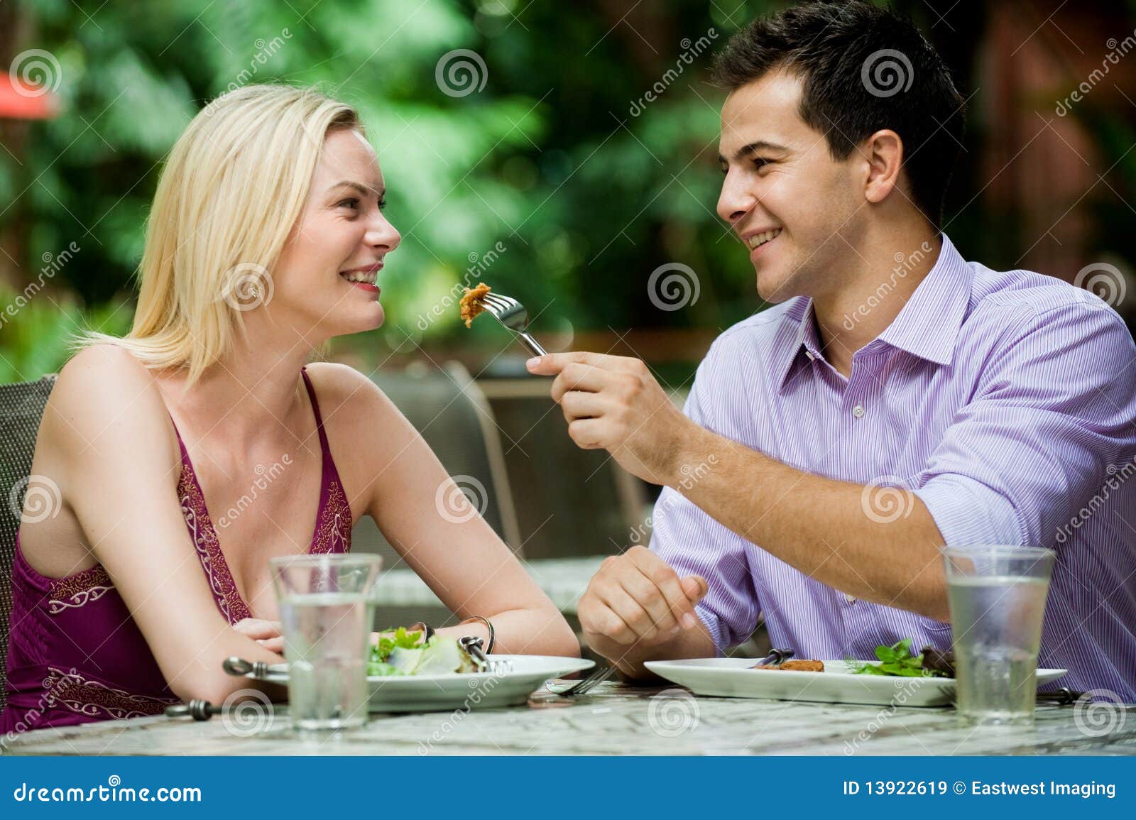 Couple Having Meal stock image. Image of laughing, beautiful - 13922619