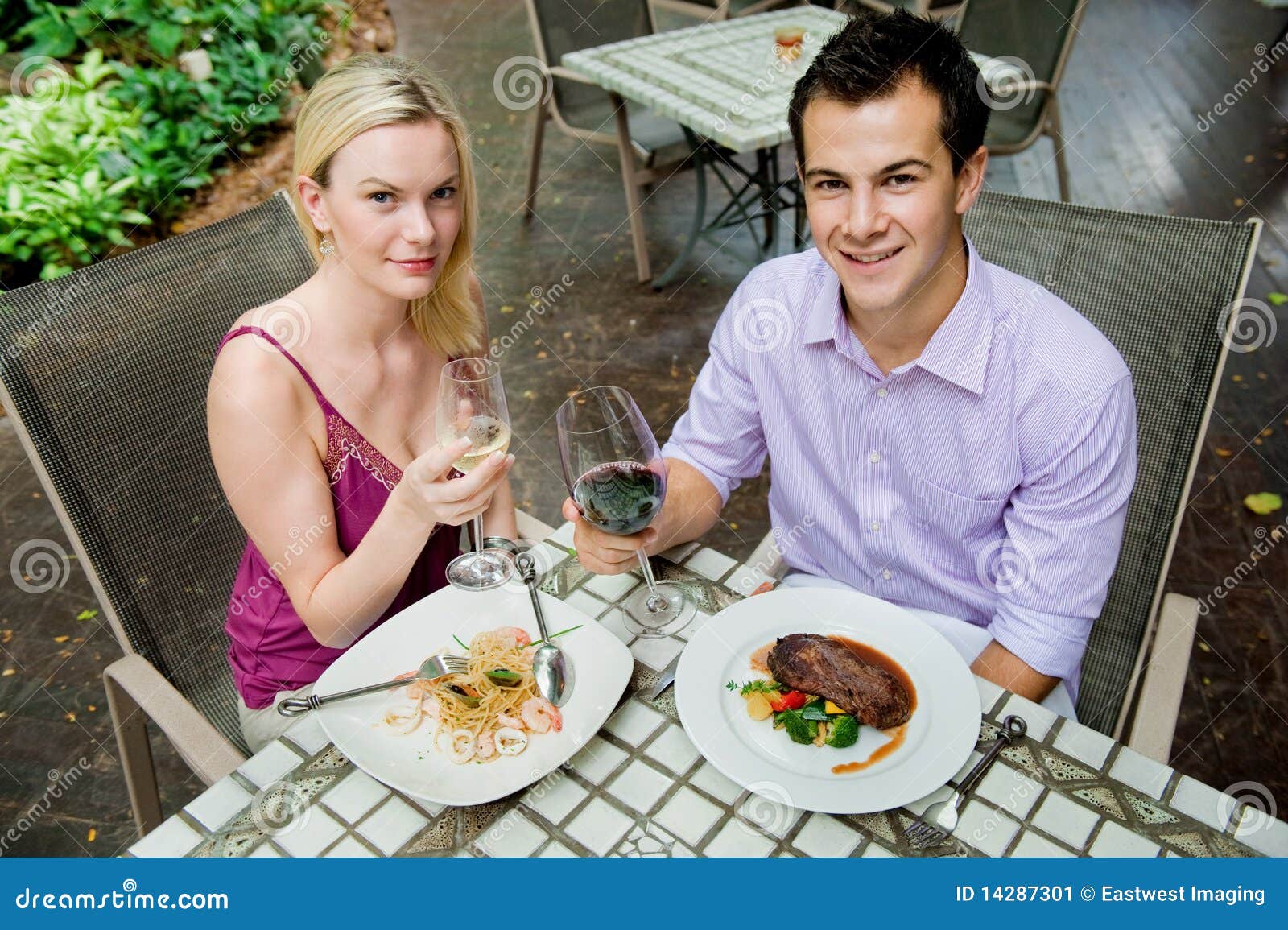 Couple Having Meal stock image. Image of holding, good - 14287301