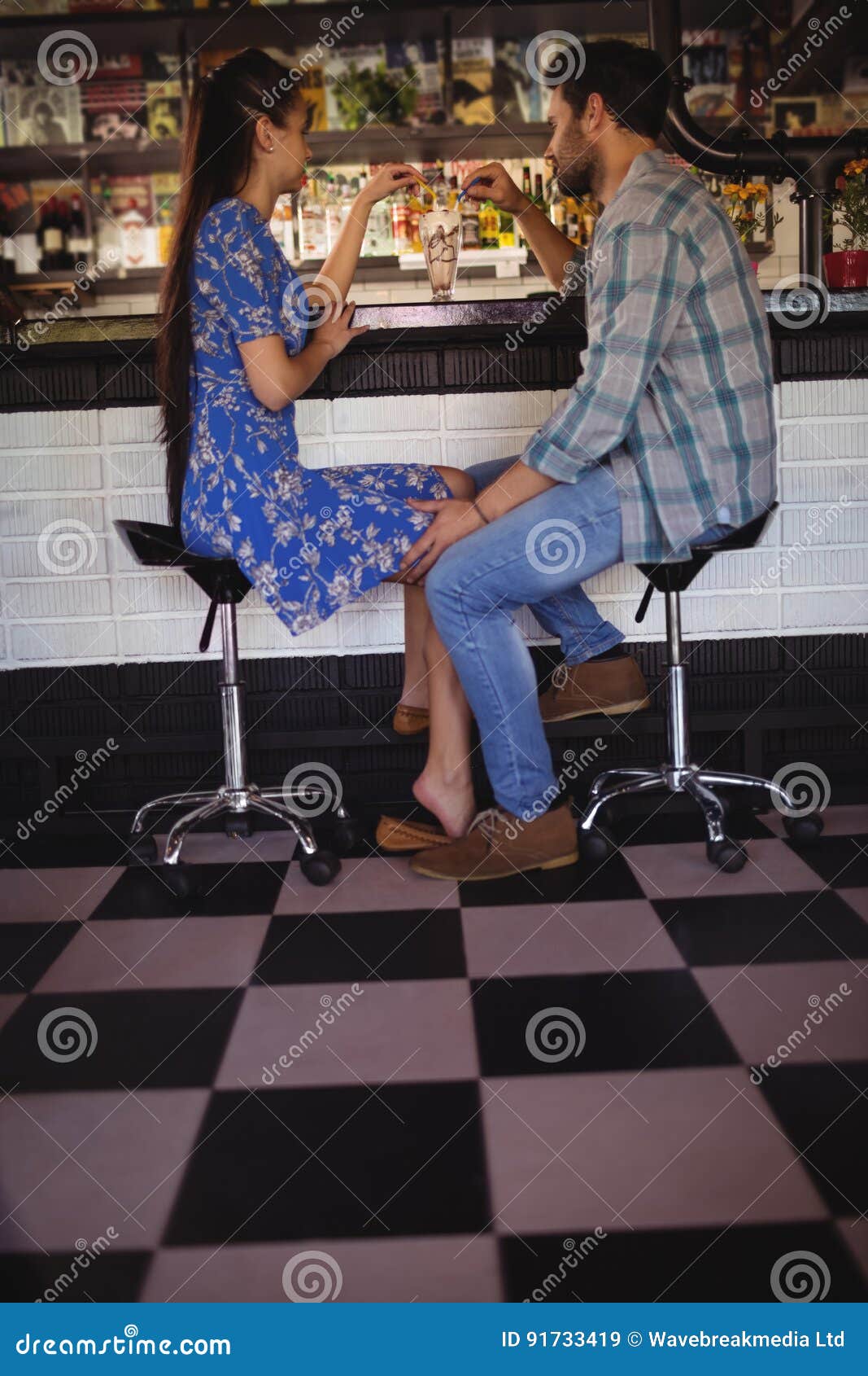 Couple Having Milkshake at Counter Stock Image - Image of business ...