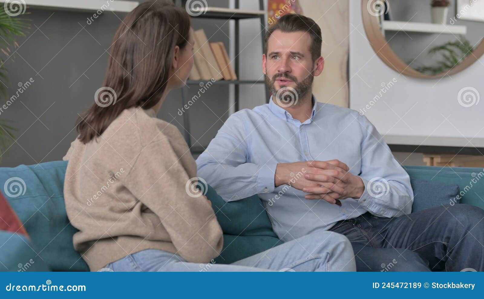 Couple Having Serious Conversation while Sitting on Sofa Stock Image ...