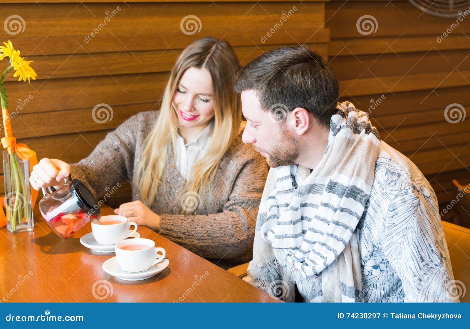 Couple having tea together stock image. Image of connection - 74230297