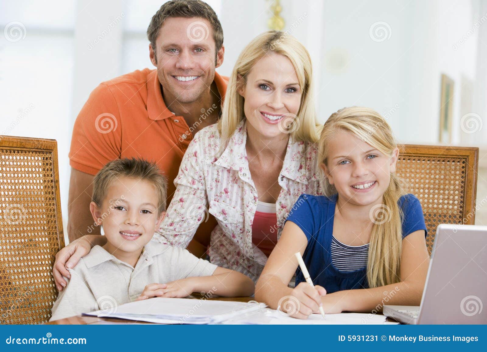 Couple Helping Children with Laptop Doing Homework Stock Image - Image ...