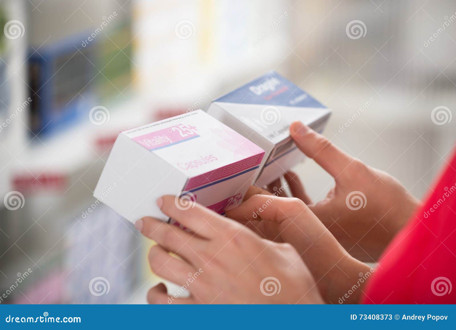 Couple Holding Capsule Packets at Store Stock Image - Image of ...
