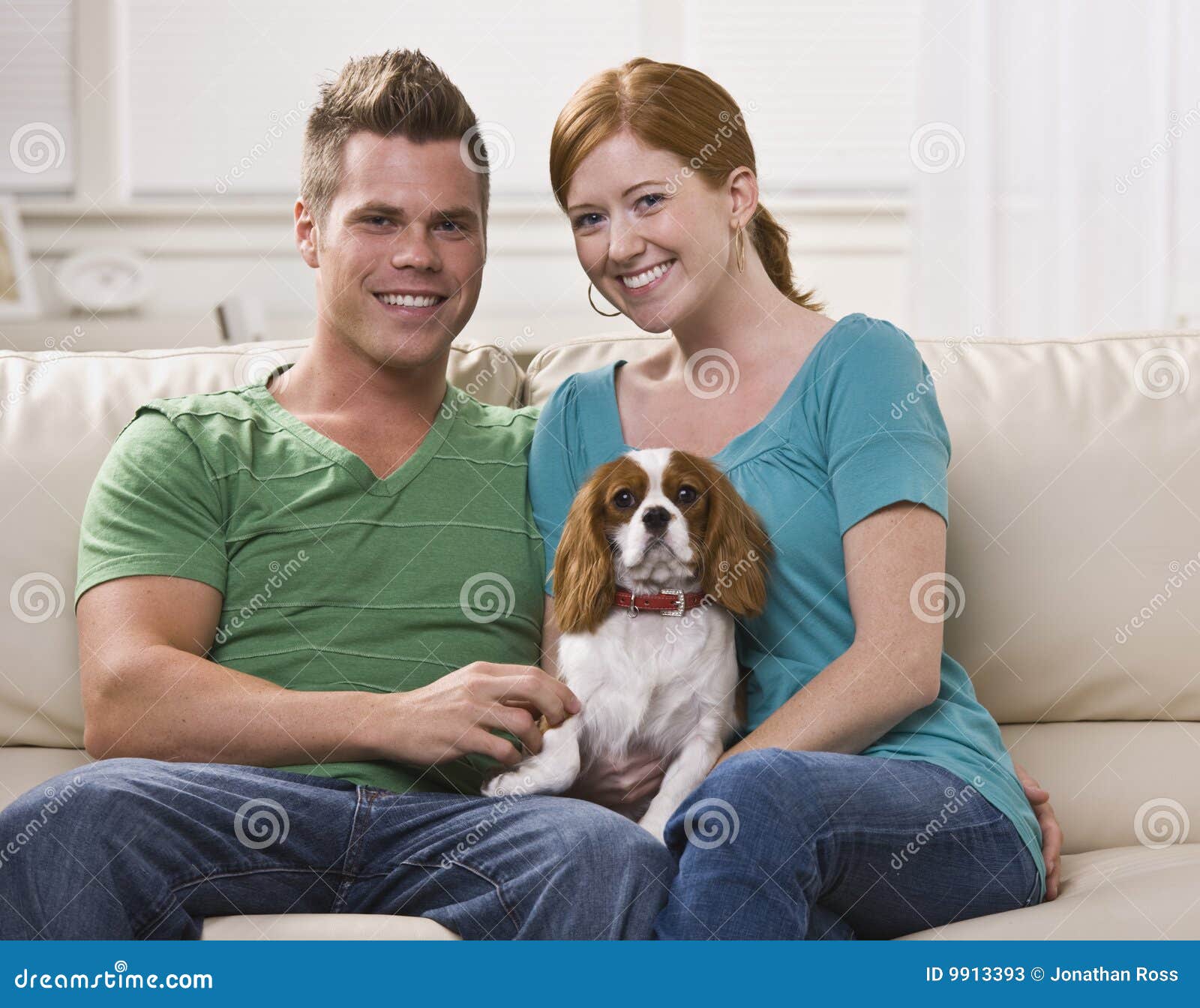 Couple Holding Dog stock image. Image of love, caucasian - 9913393