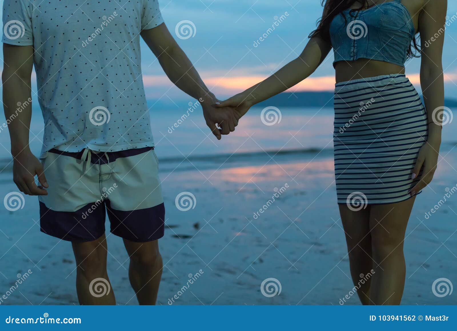 Couple Holding Hands On Beach At Sunset Closeup Young Tourist Man And