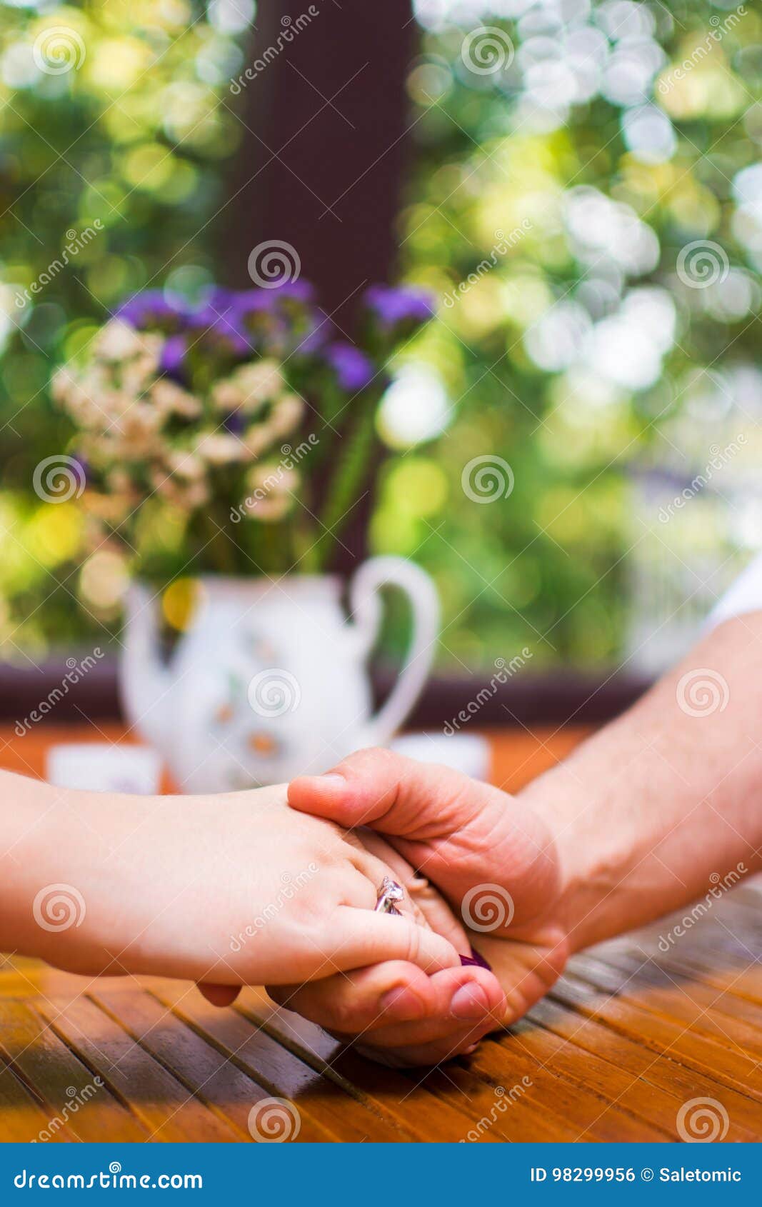 Couple Holding Hands on a Date Stock Photo - Image of hands, marriage ...