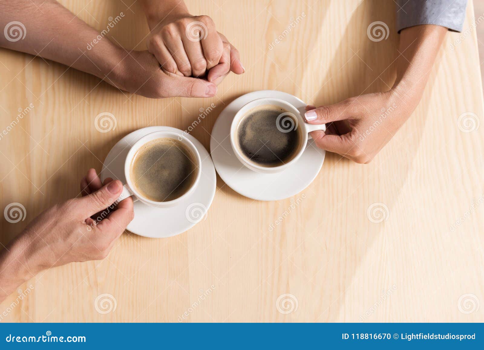Couple Holding by Hands and Drinking Coffee Stock Photo - Image of ...