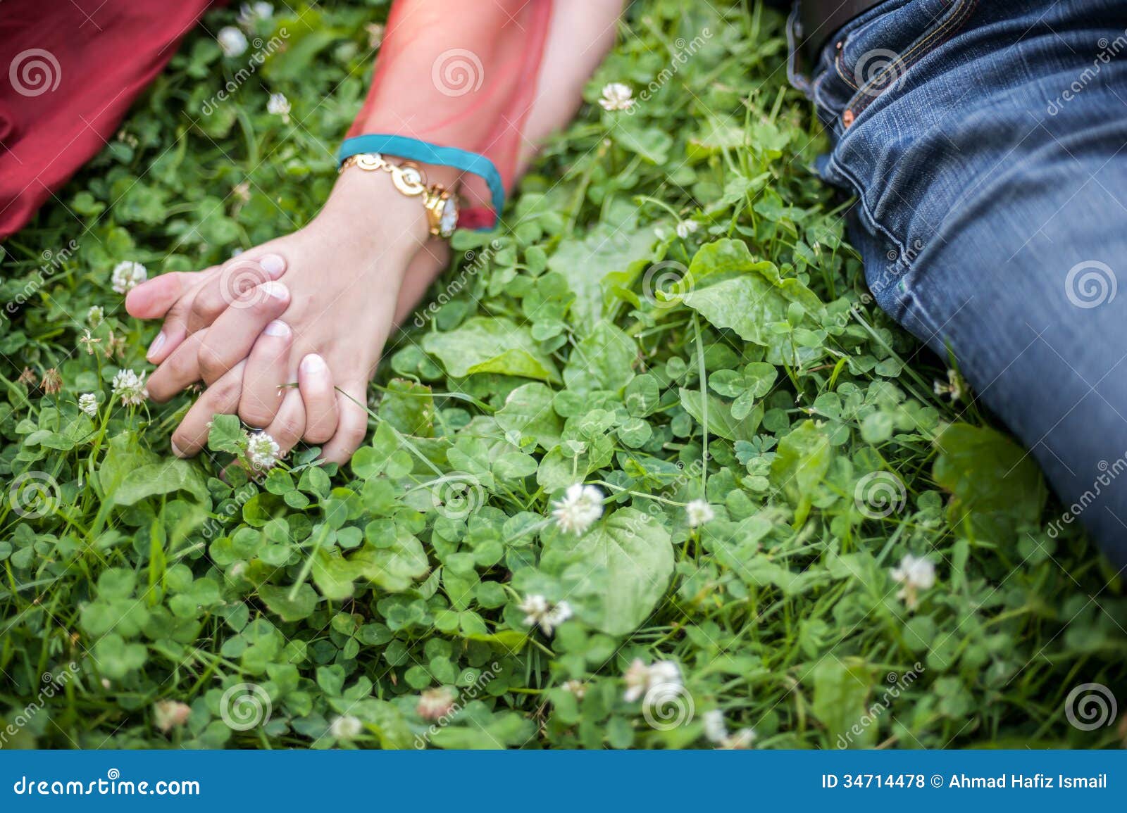 Couple Holding Hands on Grass for Love Concept Stock Photo - Image of ...