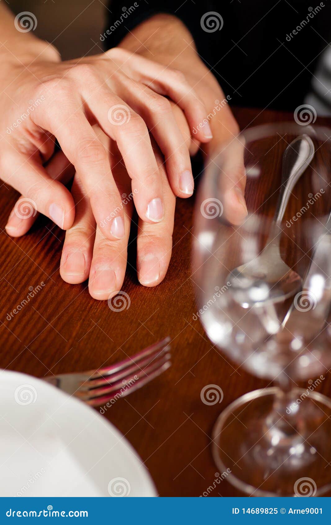 Couple Holding Hands on a Restaurants Table Stock Image - Image of ...