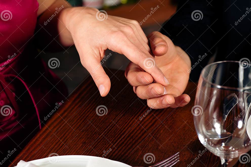 Couple Holding Hands on a Restaurants Table Stock Photo - Image of wine ...