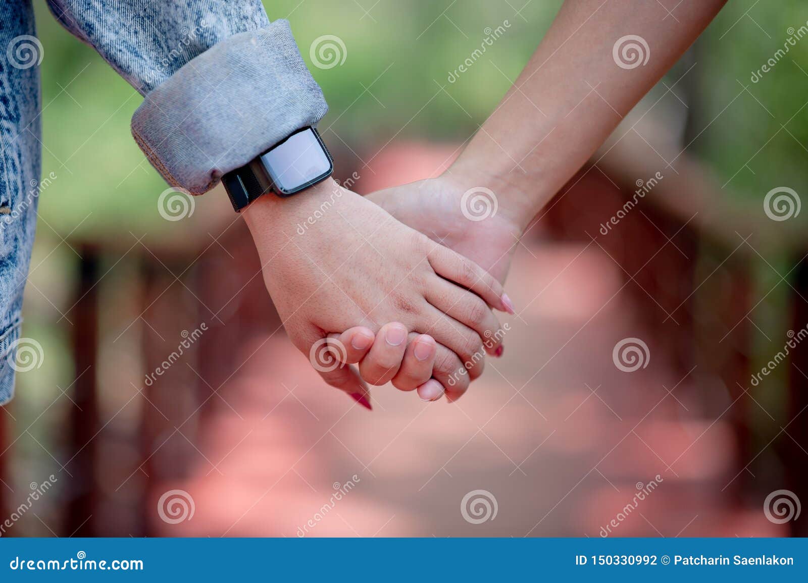Couple Holding Hands Shows Love on the Day of Love. the Day of Love ...