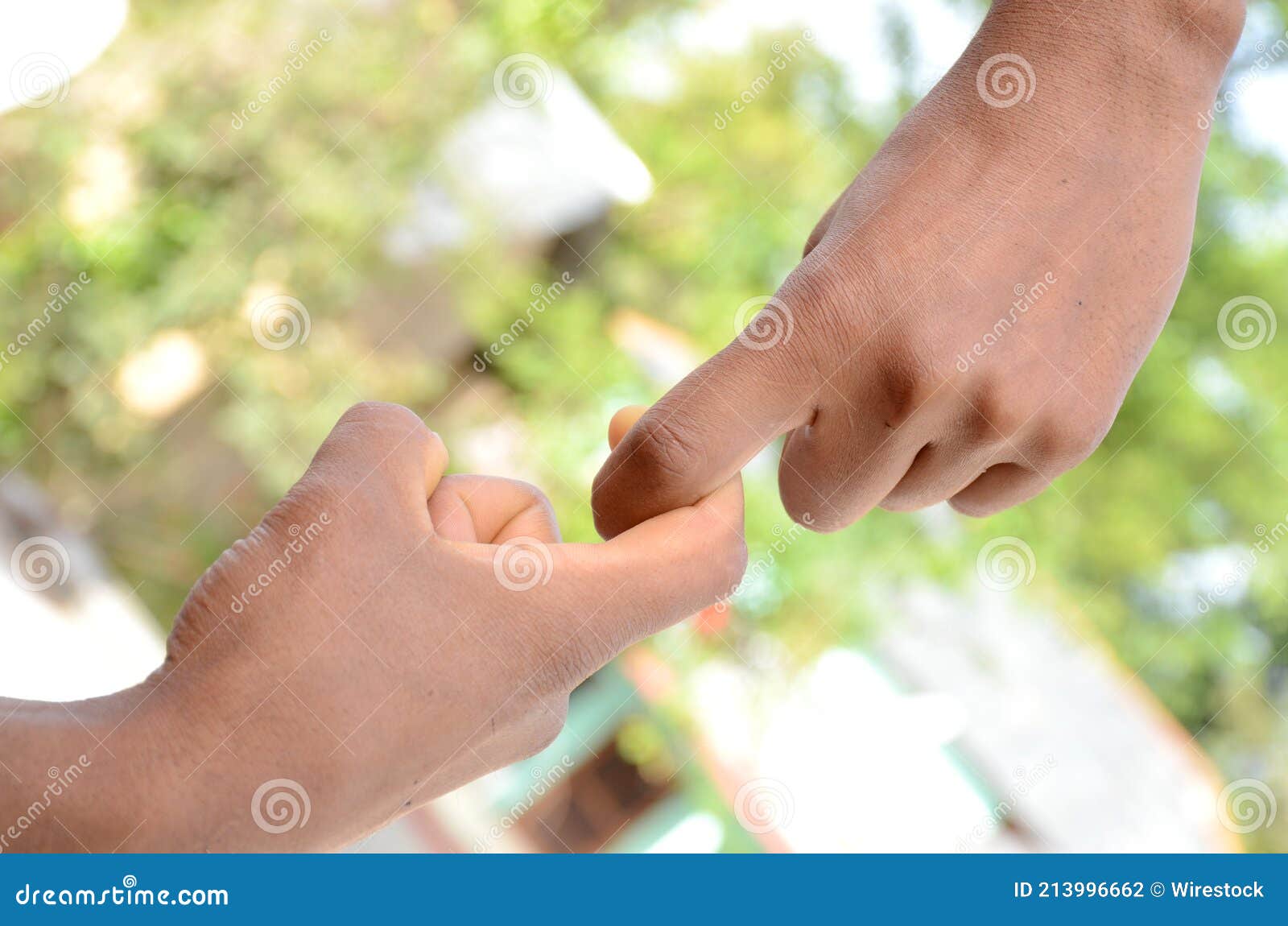 Couple Holding Index Fingers Stock Photo - Image of female, together ...