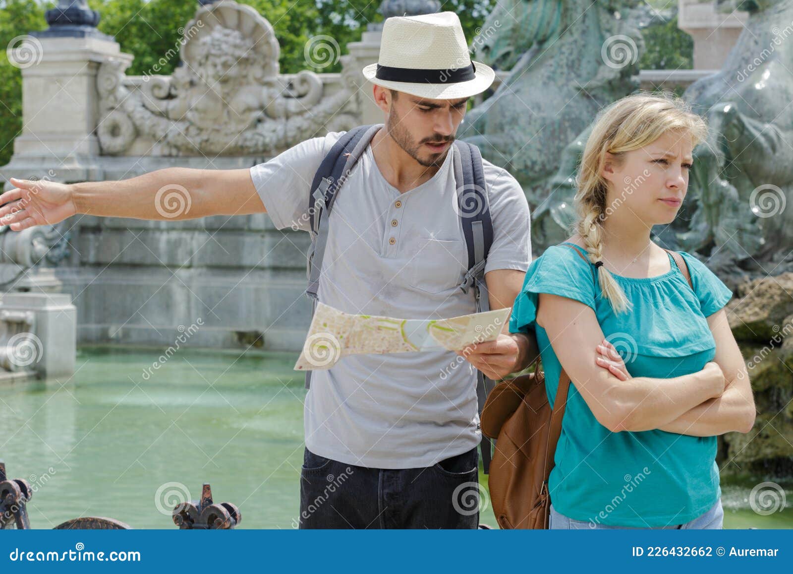 Couple Holding Map Arguing Over Which Direction To Take Stock Photo ...