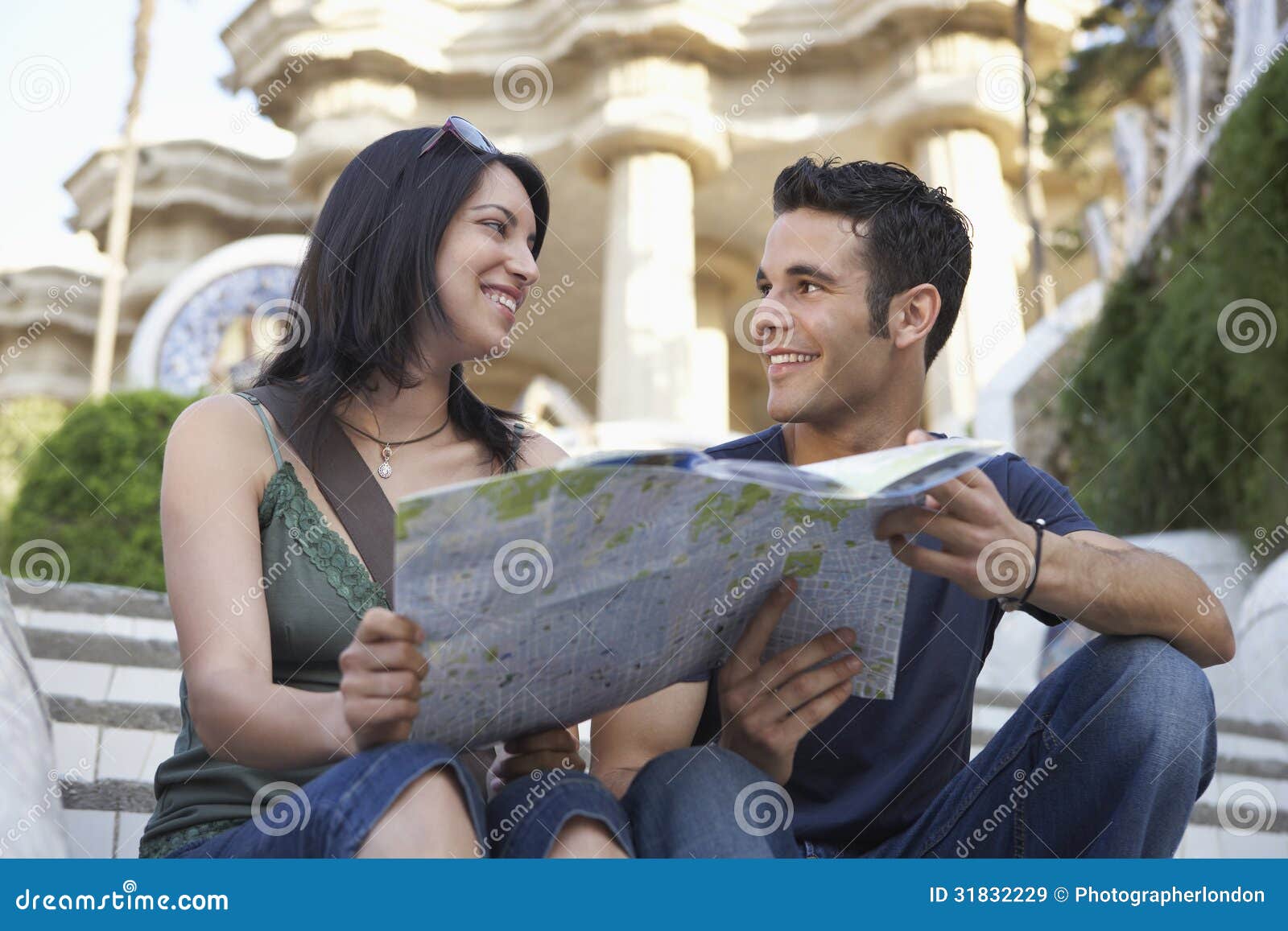 Couple Holding Map on Steps Stock Image - Image of adult, foreground ...
