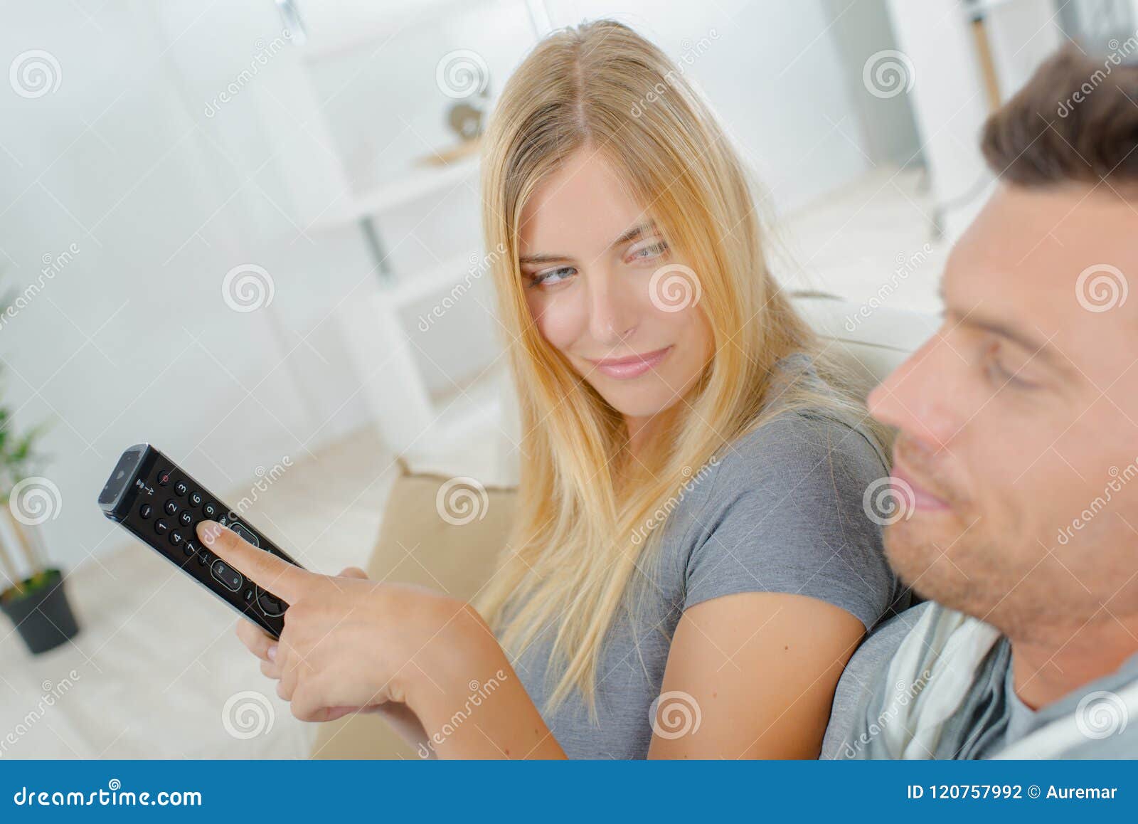 Couple Holding Remote Control Stock Photo - Image of control ...