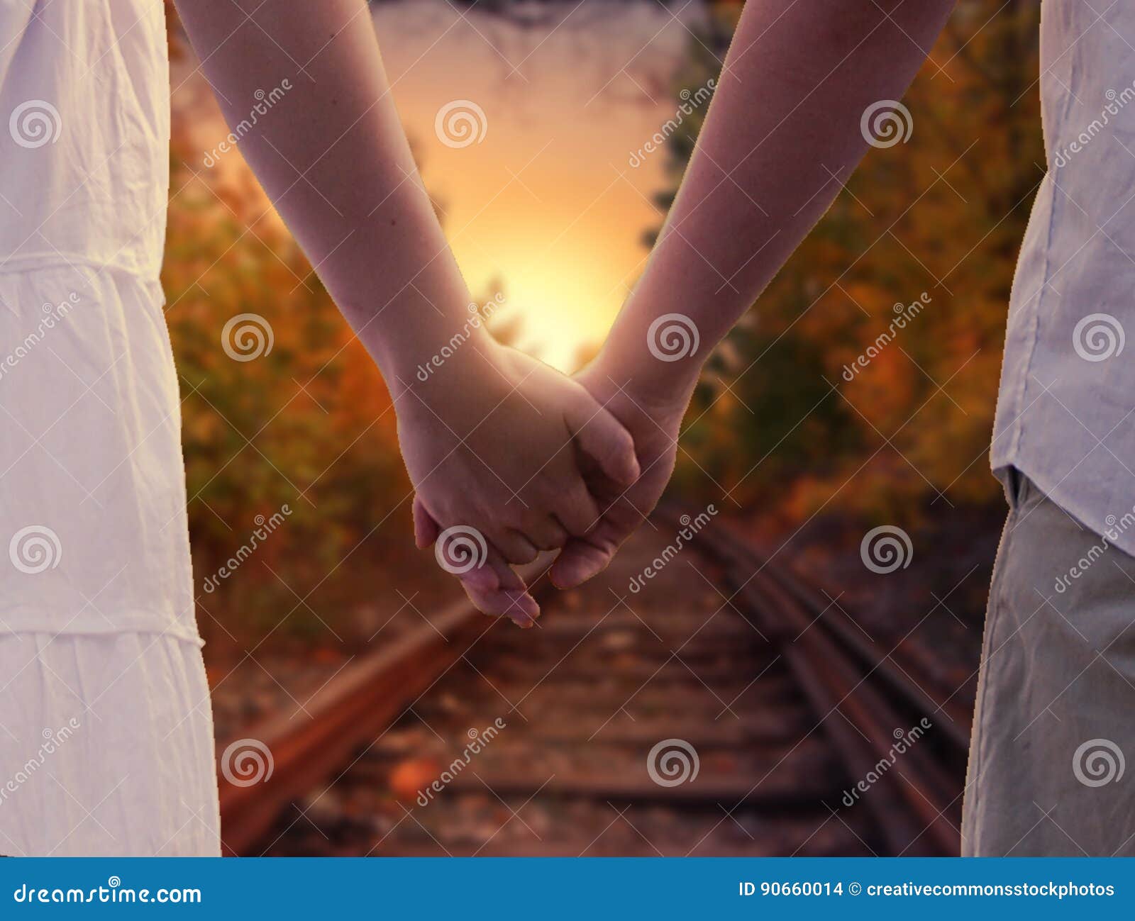 Couple Holding In Train Rails During Golden Hour Picture. Image: 90660014