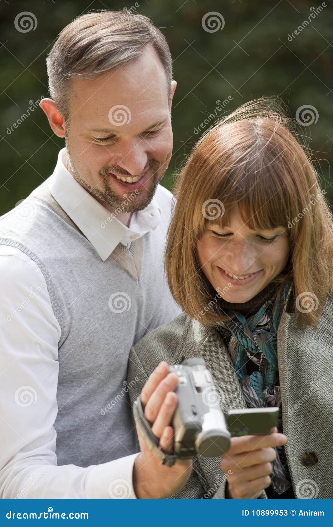 Couple Holding Video Camera Stock Image - Image of video, looking: 10899953