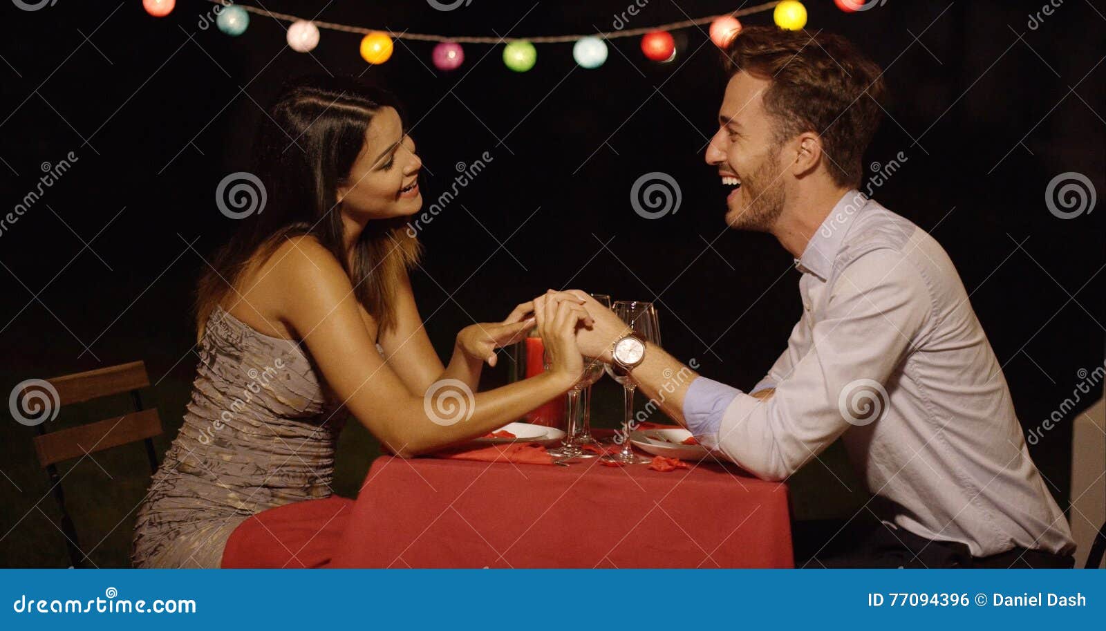 Couple Holds Hands Across Table and Smiles Stock Photo - Image of table ...