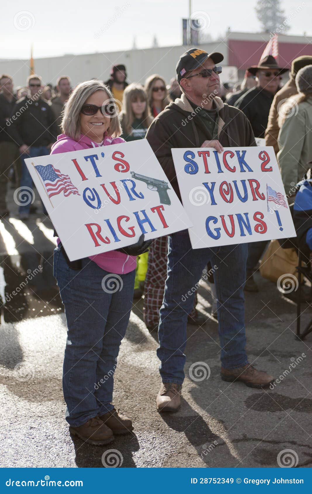 Couple Holds Signs at Rally. Editorial Stock Image - Image of protest ...