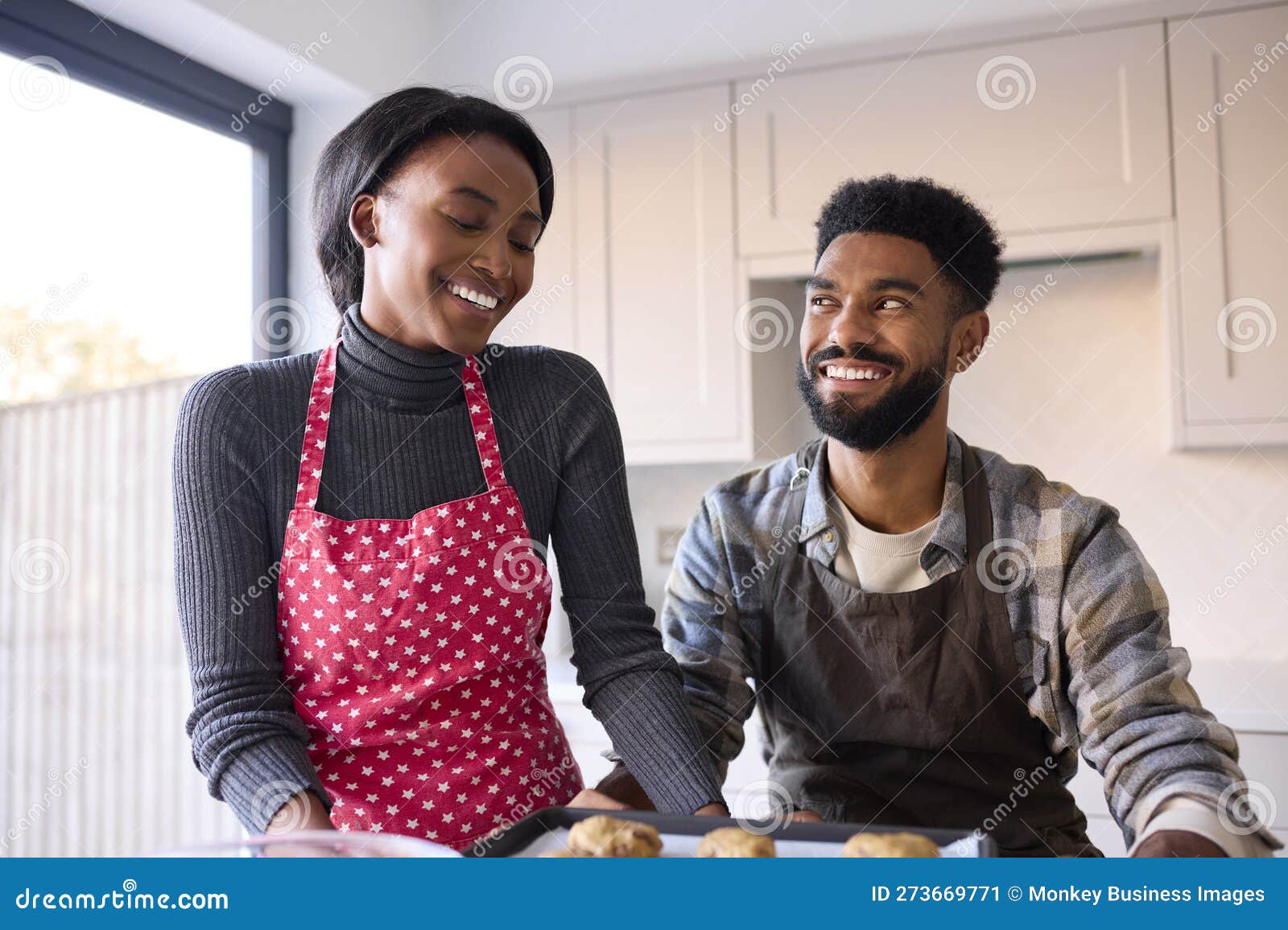 Couple at Home Baking Cookies Together in Kitchen Stock Image - Image ...