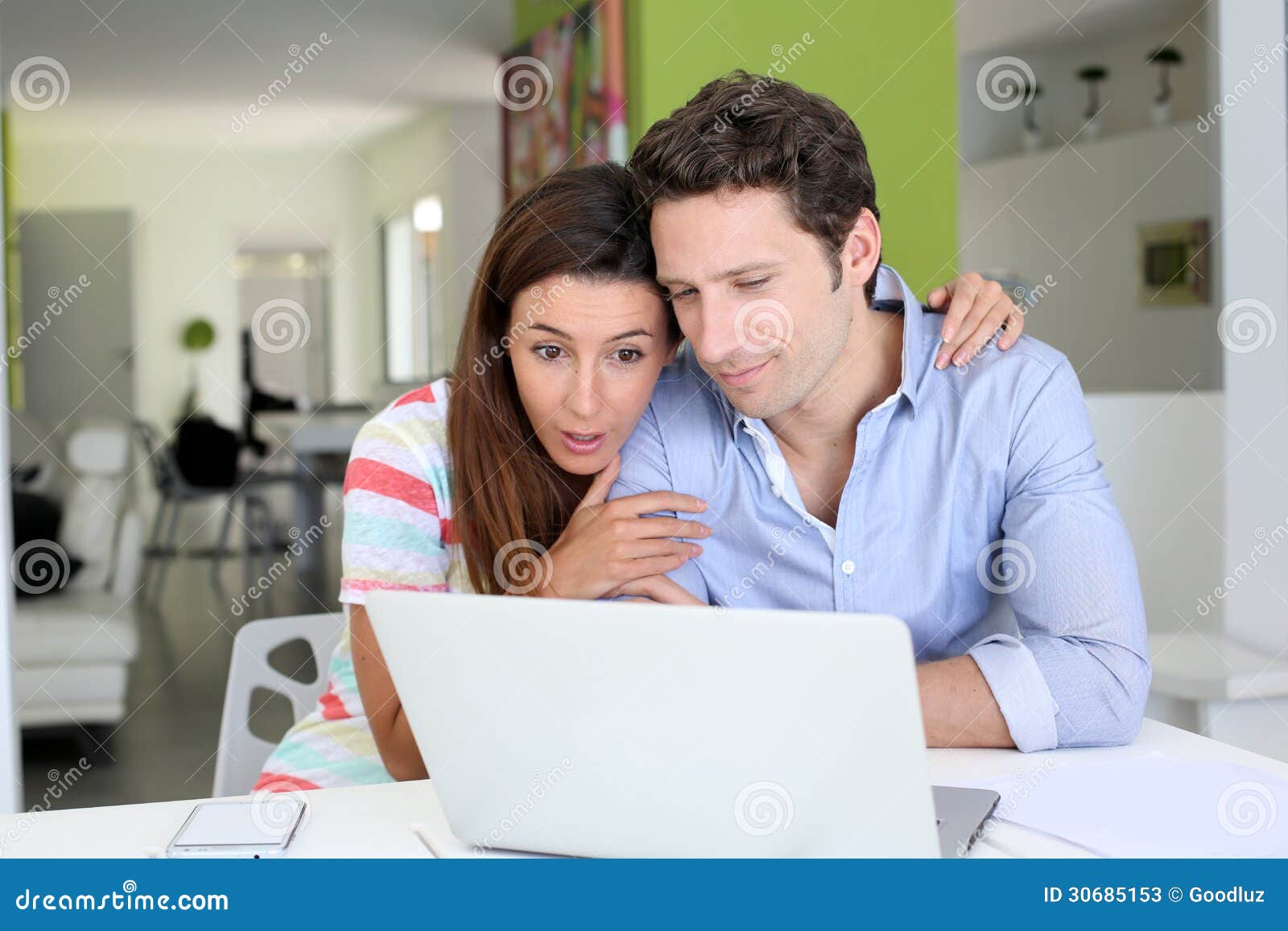 Couple at Home Looking at Computer with an Astonished Look Stock Image ...