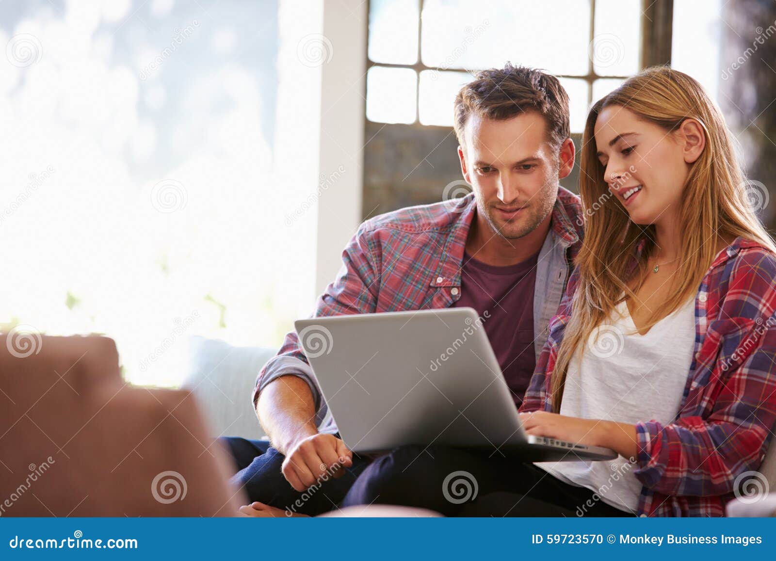 Couple at Home in Lounge Using Laptop Computer Stock Photo - Image of ...