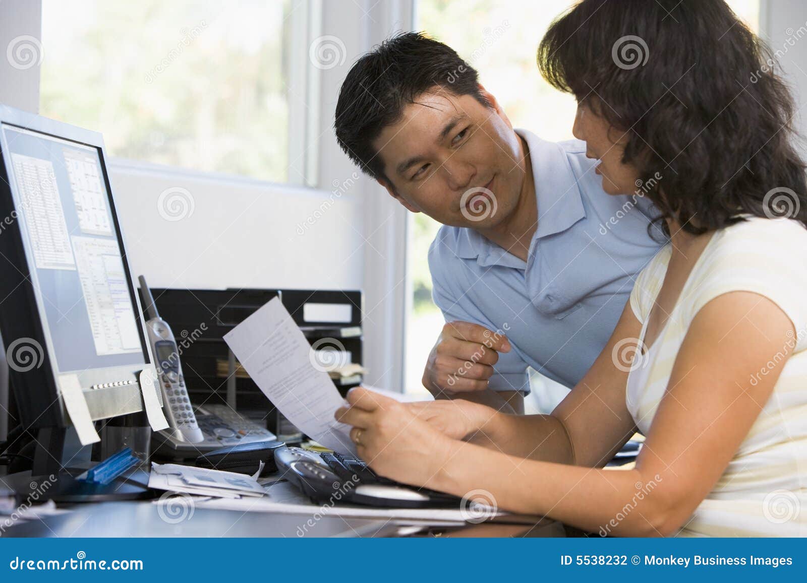 Couple in Home Office with Computer and Paperwork Stock Photo - Image ...